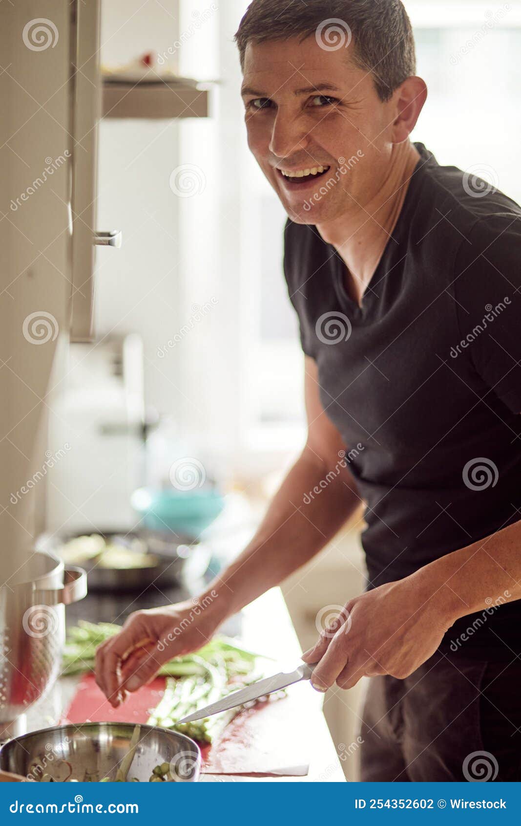 Vertical Shot of a White German Man Cooking Stock Photo - Image of ...
