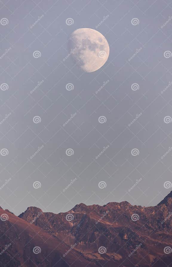 Vertical Shot of a White Half-moon Over Cliffs Stock Photo - Image of ...