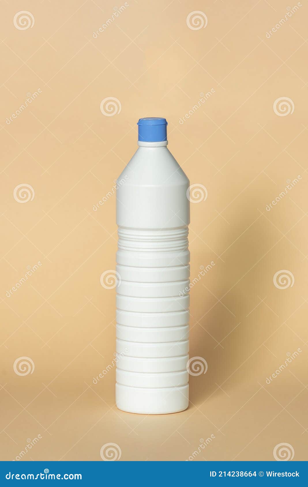 Vertical Shot of a White Plastic Container with a Blue Cap Isolated on ...