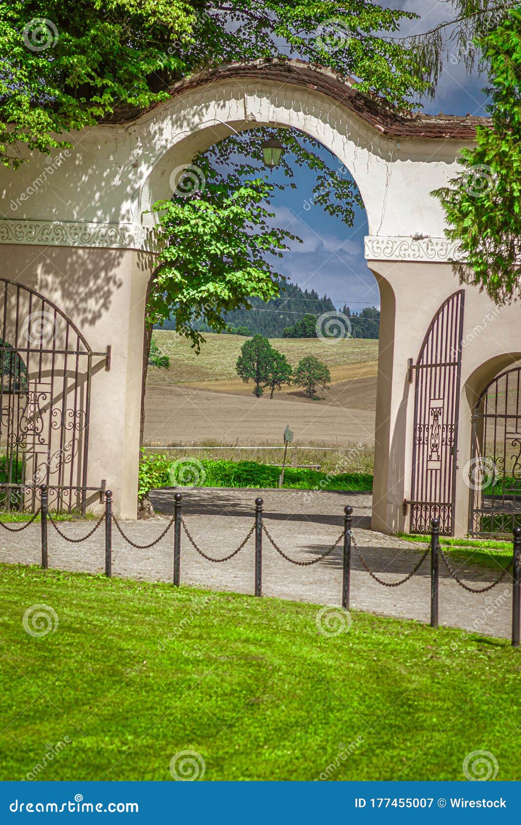 Vertical Shot of a Wide Open Gate of a Park Stock Image - Image of open ...