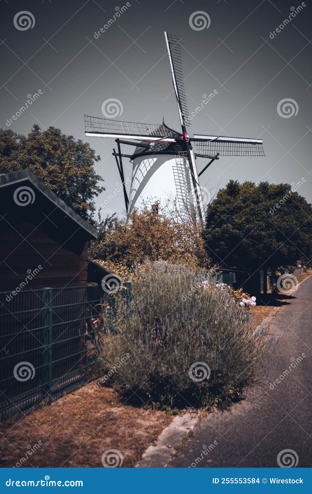 Vertical Shot of a Windmill in the Countryside Stock Photo - Image of ...