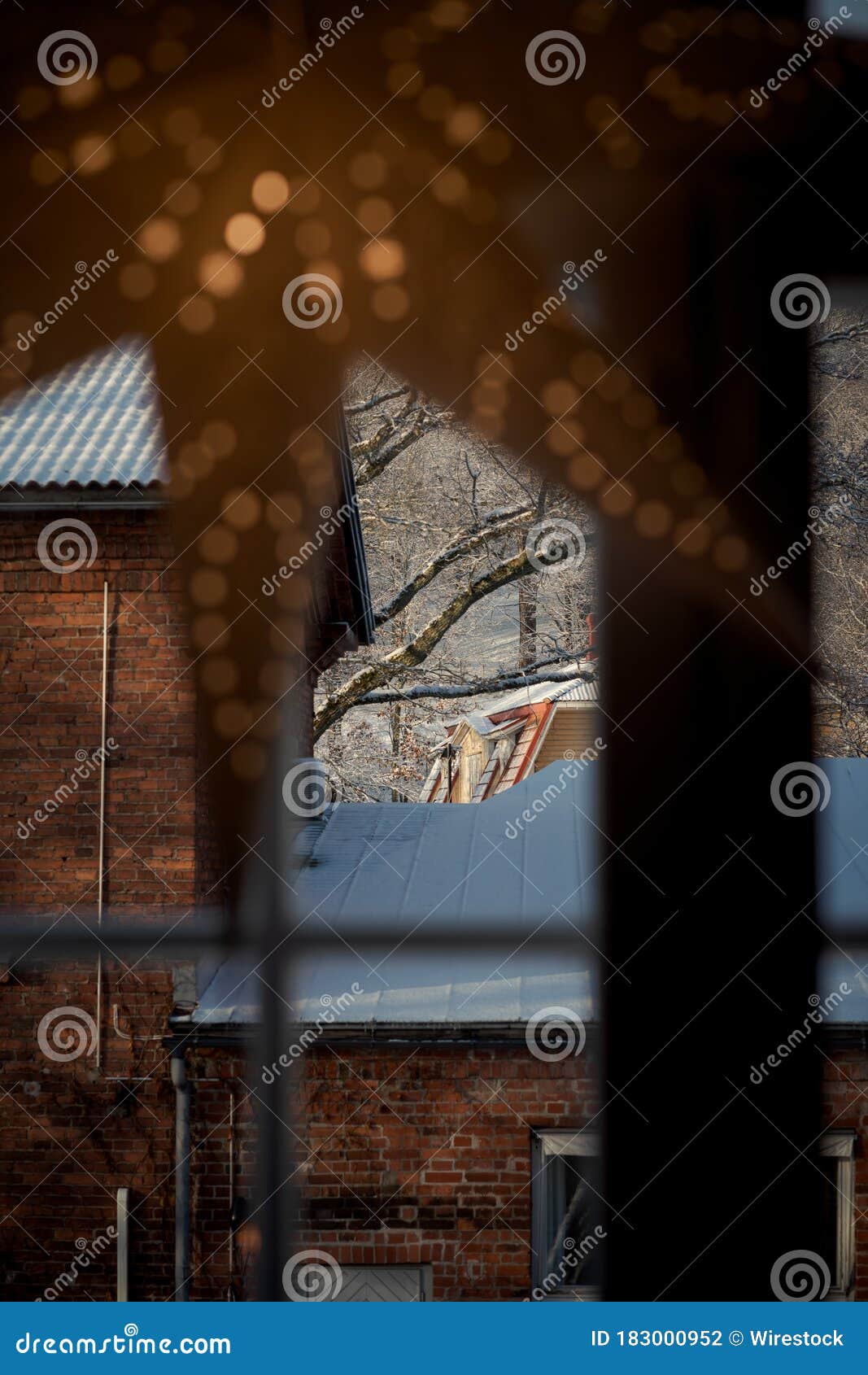 Vertical Shot of a Window with a View of Brown Buildings Stock Photo ...