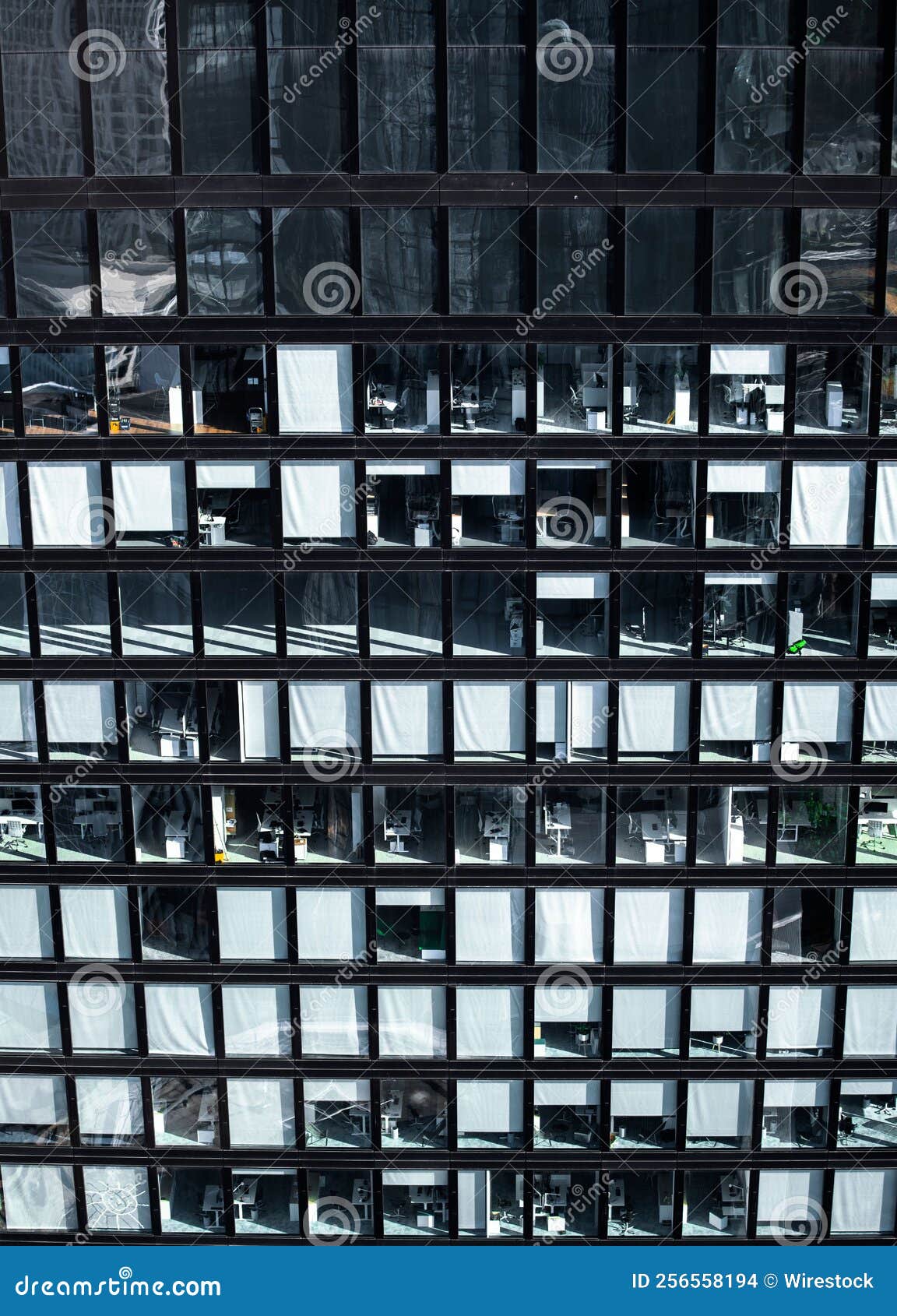Vertical Shot of the Windows of a Busy Office in the Skyscraper Stock ...