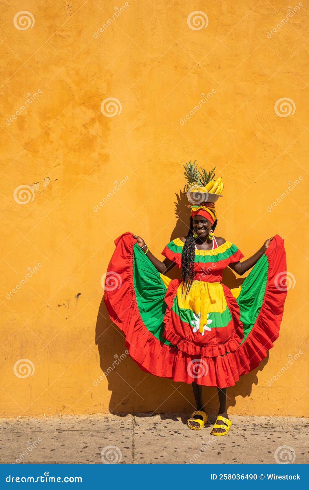 Vertical Shot of a Woman Wearing Traditional Dress in Cartagena ... Vertical Shot of a Woman Wearing Traditional Dress in Cartagena ...
