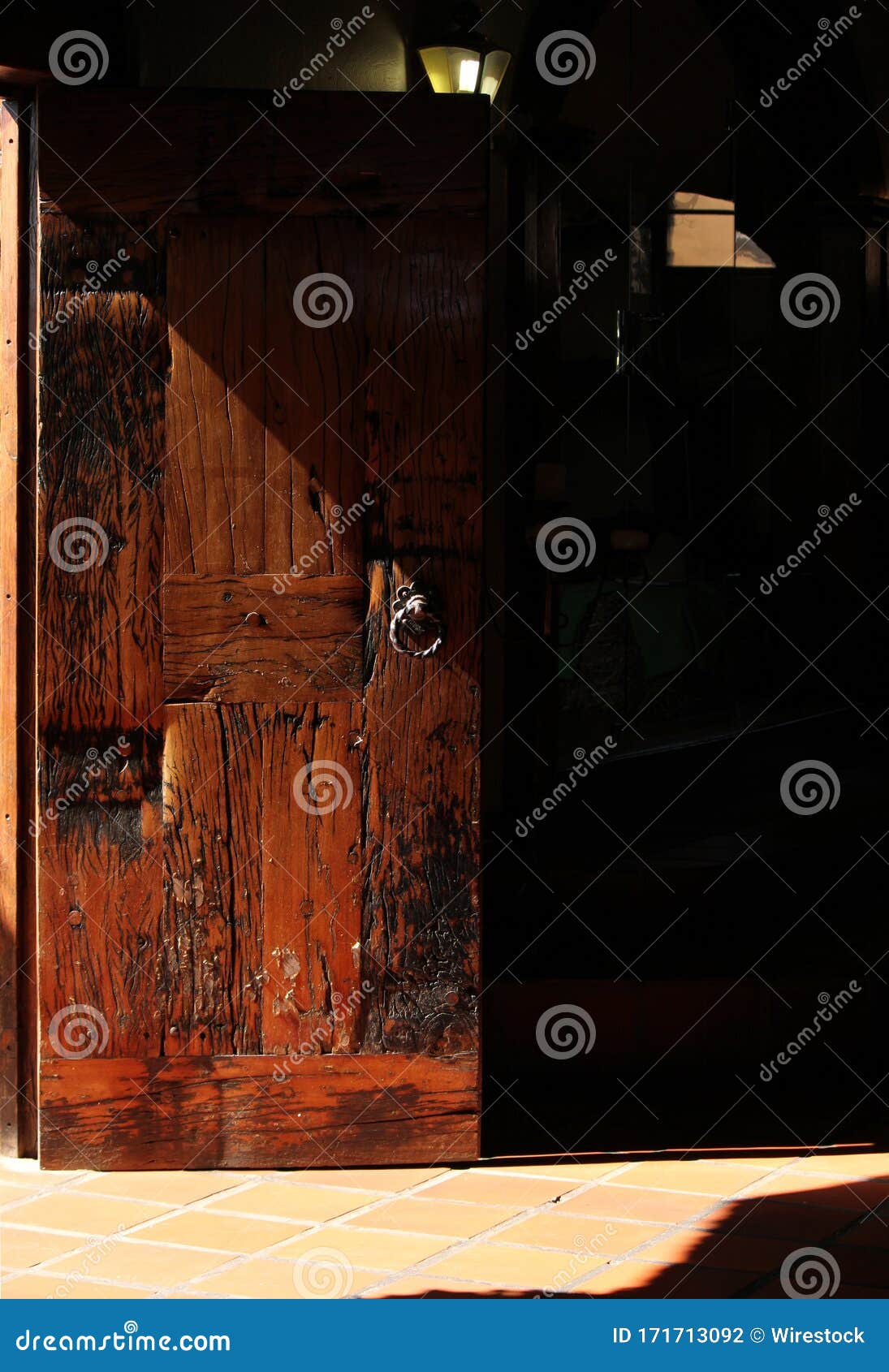 Vertical Shot of a Wooden Door Covered in a Shadow Stock Photo - Image ...