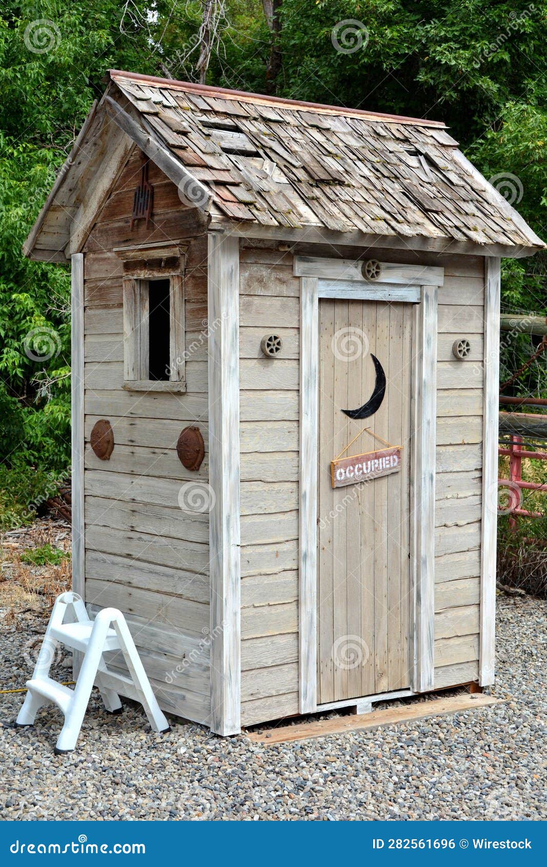Vertical Shot of a Wooden Outhouse in a Park Stock Photo - Image of ...