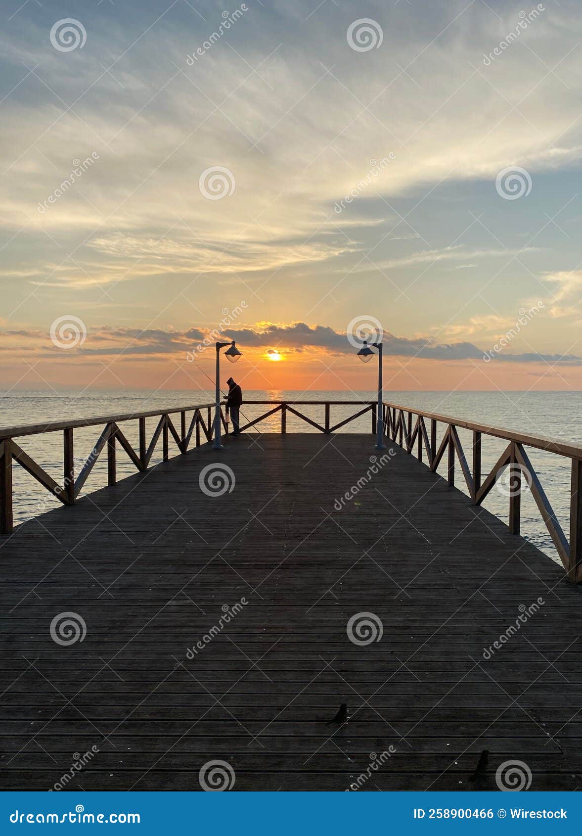 Vertical Shot of a Wooden Pier at the Beach at a Mesmerizing Soft ...