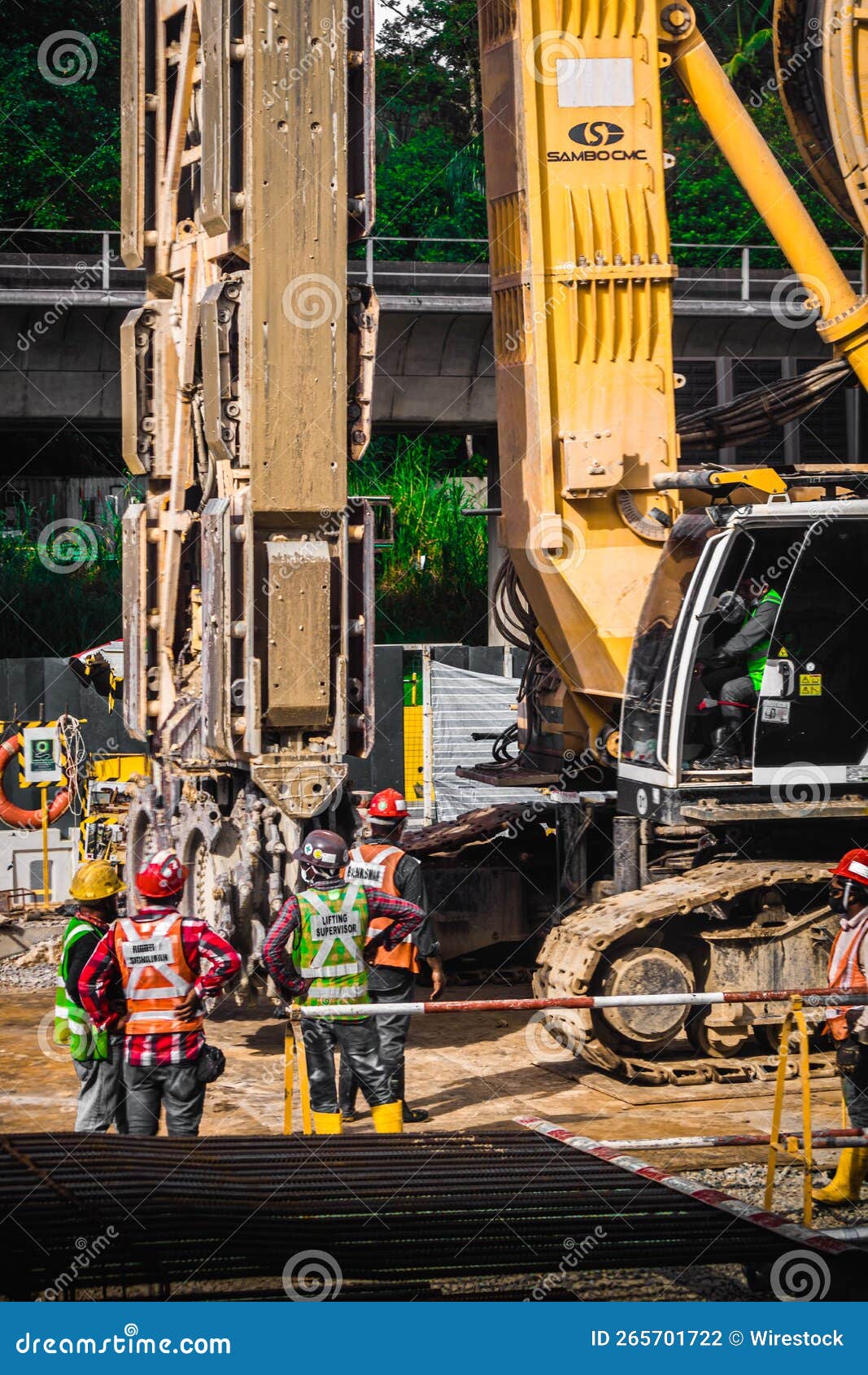 Vertical Shot of Workers Working on a Construction Site Project ...