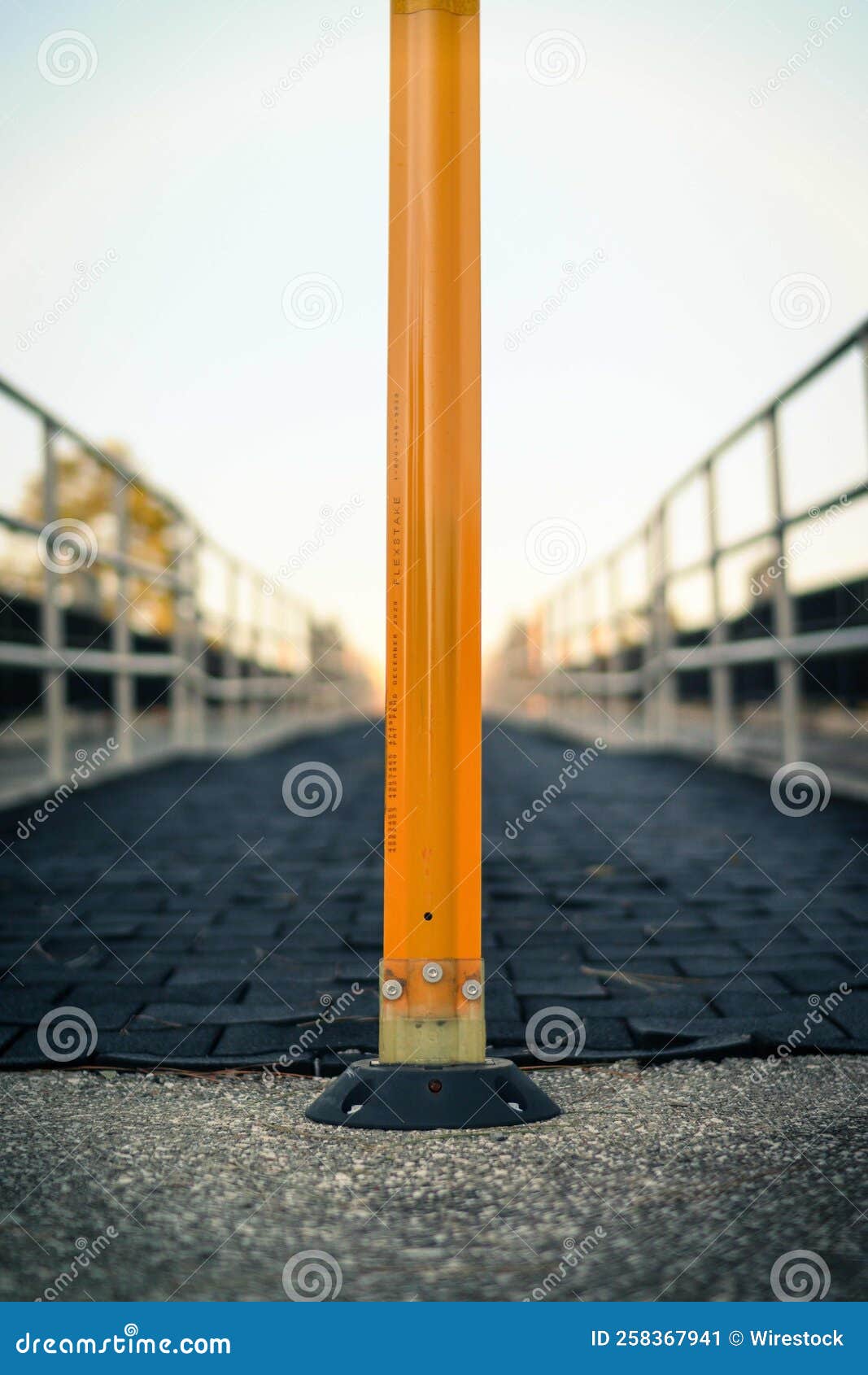 Vertical Shot of a Yellow Pole on the Ground Outdoors Stock Image ...