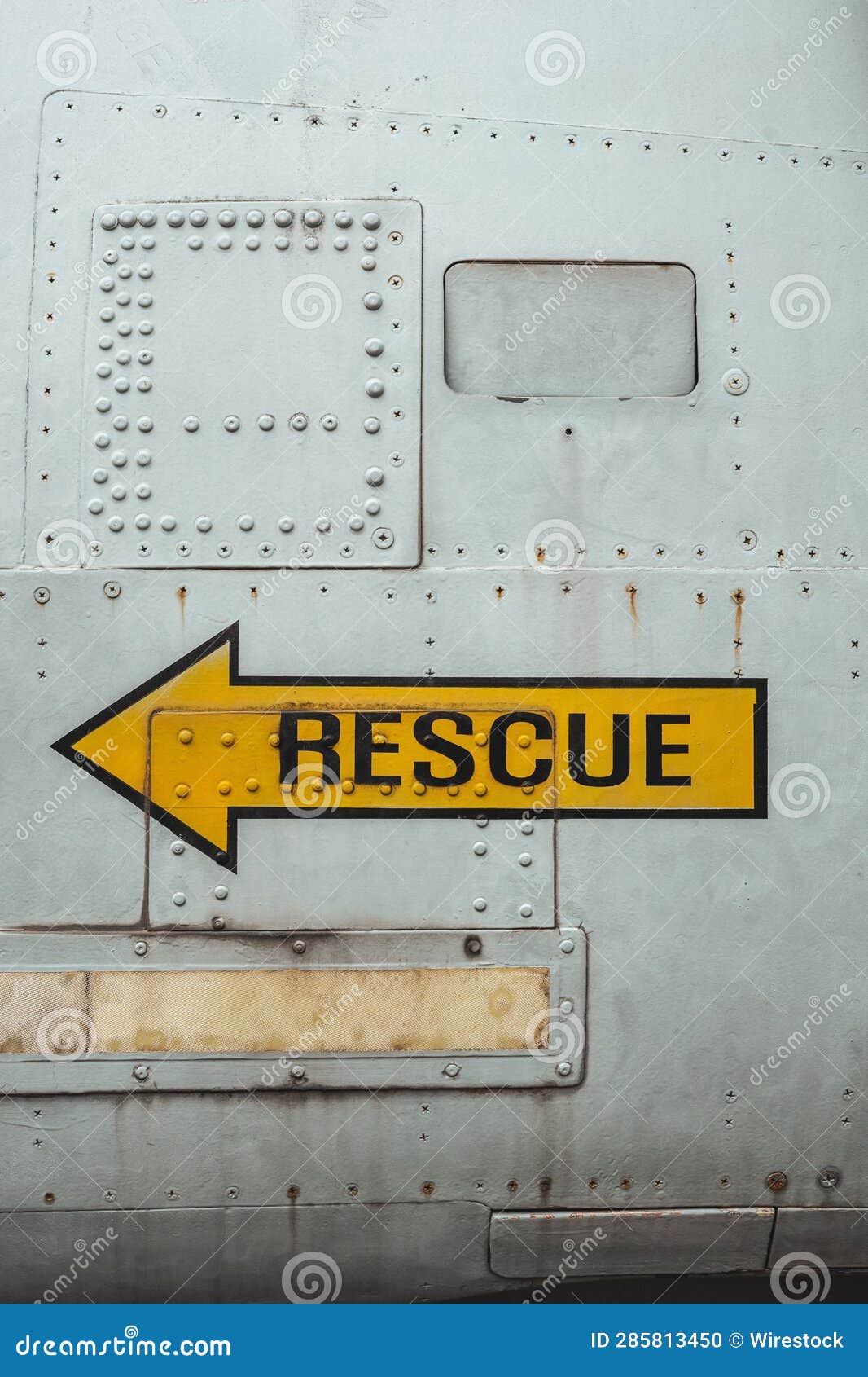 Vertical Shot of a Yellow RESCUE Arrow on a Metal Surface Stock Photo ...