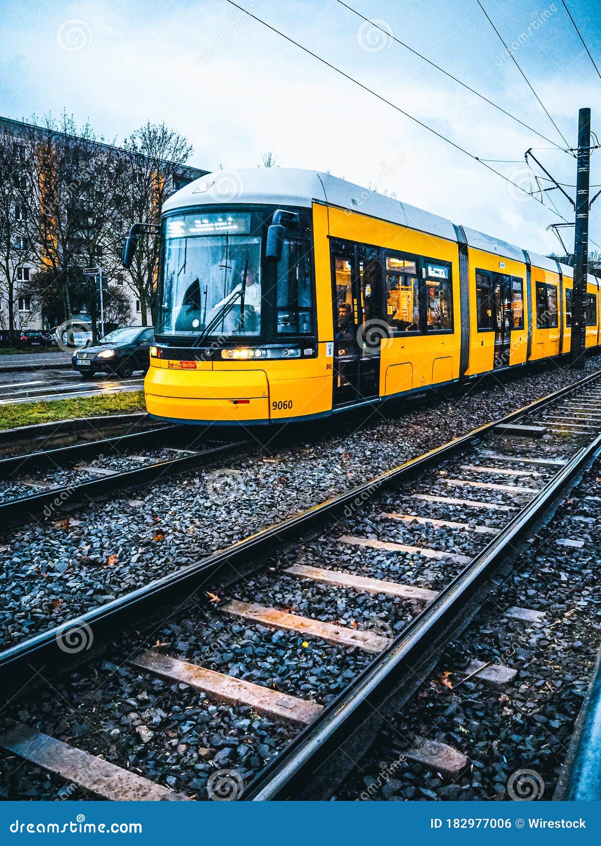 Vertical Shot of a Yellow Train in Motion on the Outdoor Railway ...