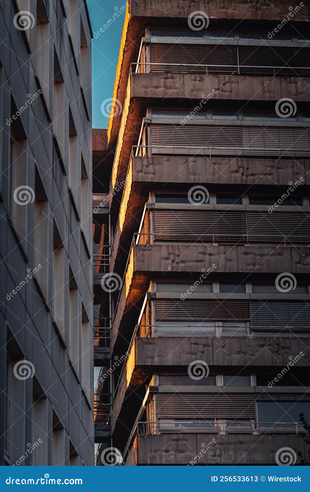 Vertical Side Shot of a Skyscraper at Sunrise with Blue Sky in the ...