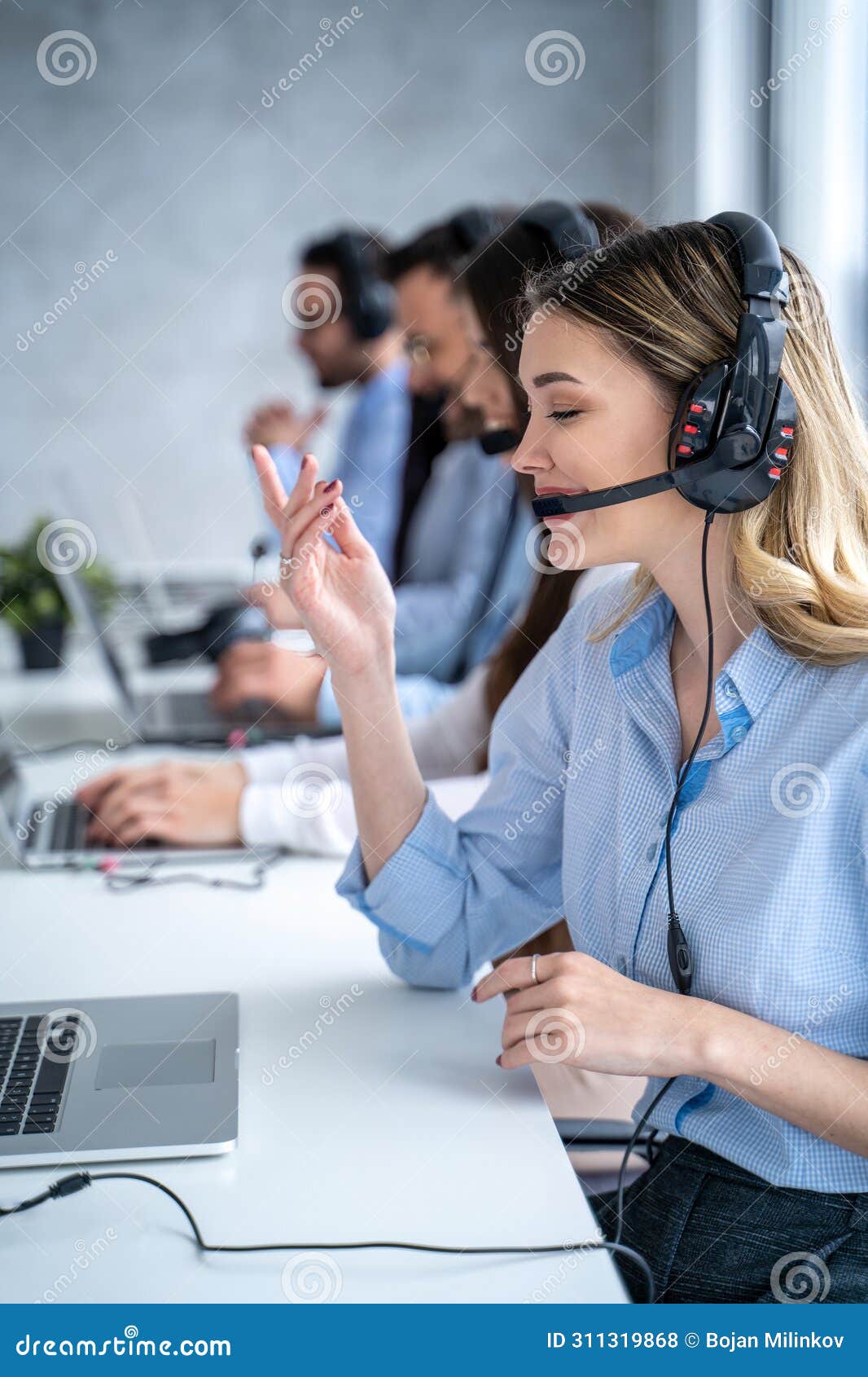 Vertical Side View of Beautiful Blond Hair Call Canter Agent Working ...