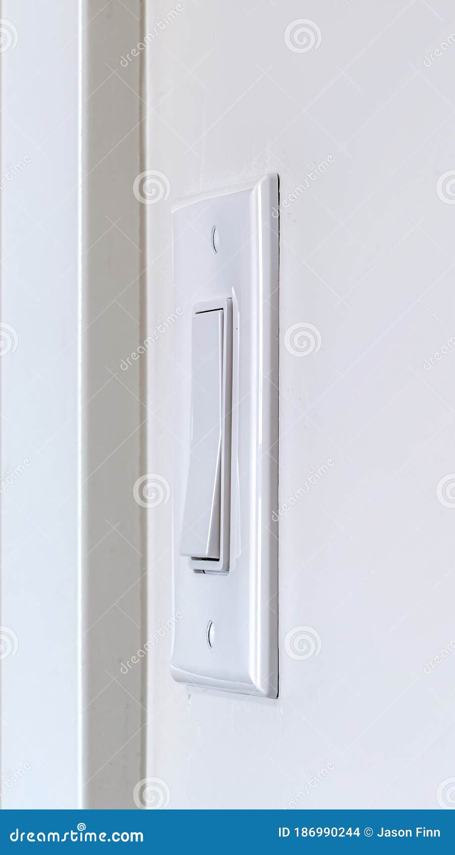 Vertical Side View of Electrical Rocker Light Switch Mounted on White ...
