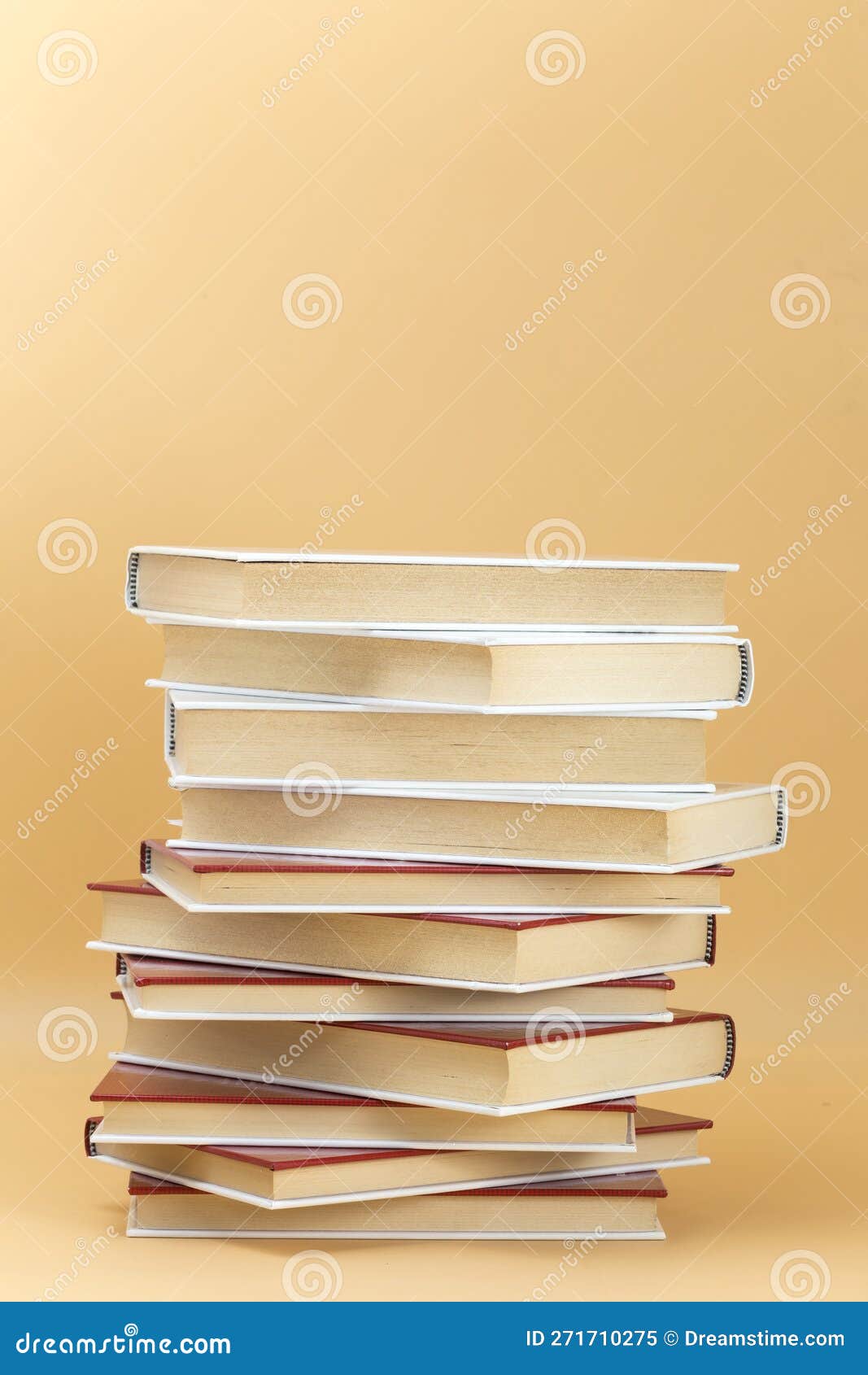 Vertical Stack of Books on an Orange Background Stock Image - Image of ...