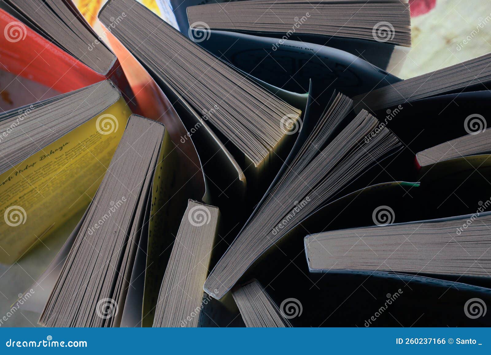 Vertical Stack of Books with Silhouette in City Library Stock Photo ...