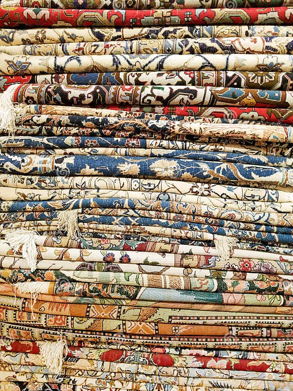 Vertical Stack of Colorful Middle Eastern Style Rugs and Carpets Stock ...