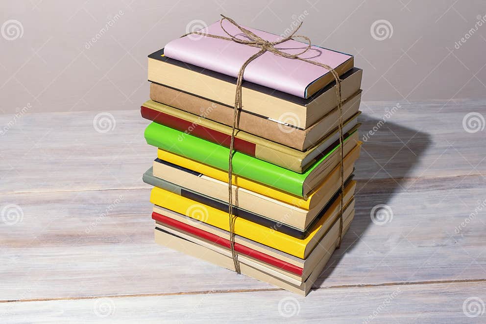 Vertical Stack of Different Books Tied with Rope Stock Image - Image of ...