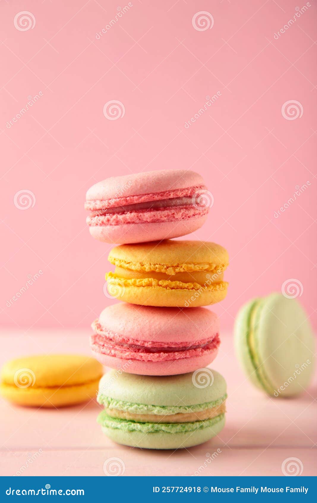 A Vertical Stack of Three Macarons on Pink Background. Sweet Dessert ...