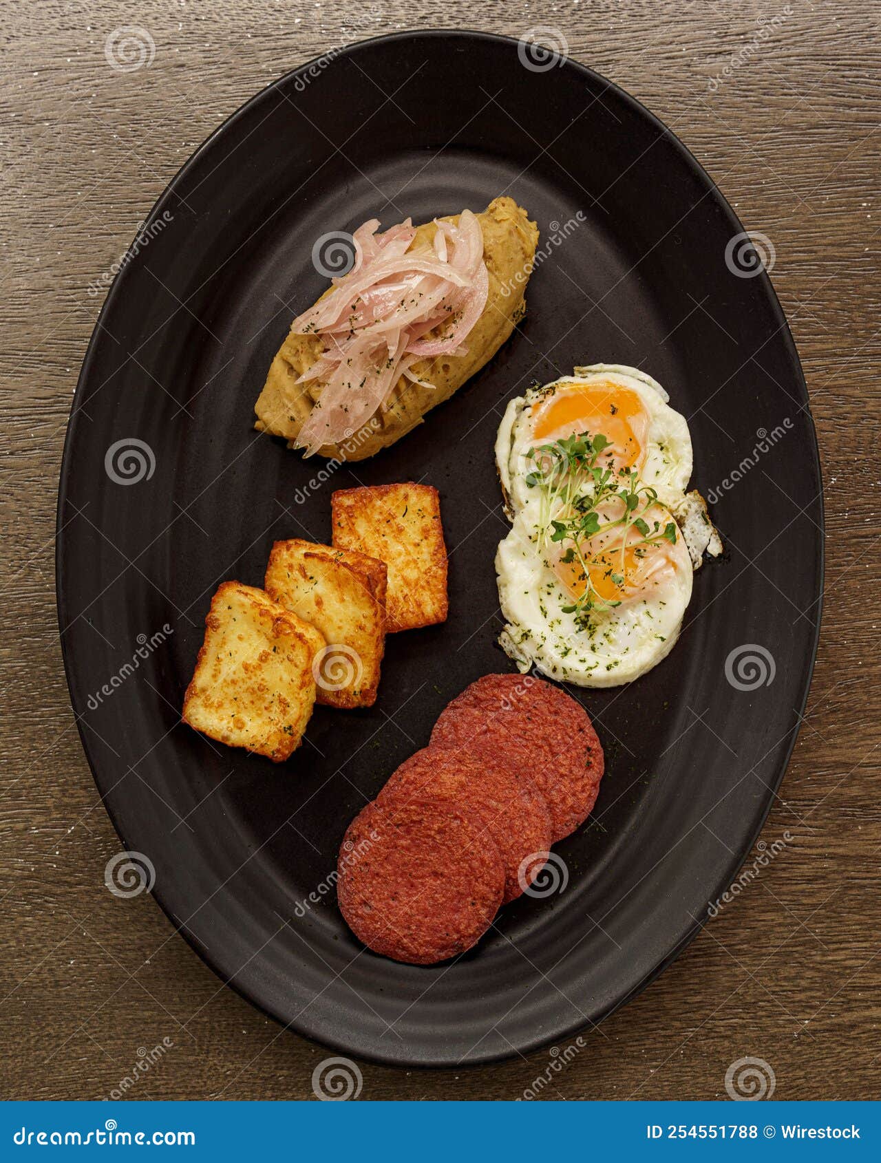 Vertical and Top Shot of the Mangu with Cheese, Egg and Salami on a ...
