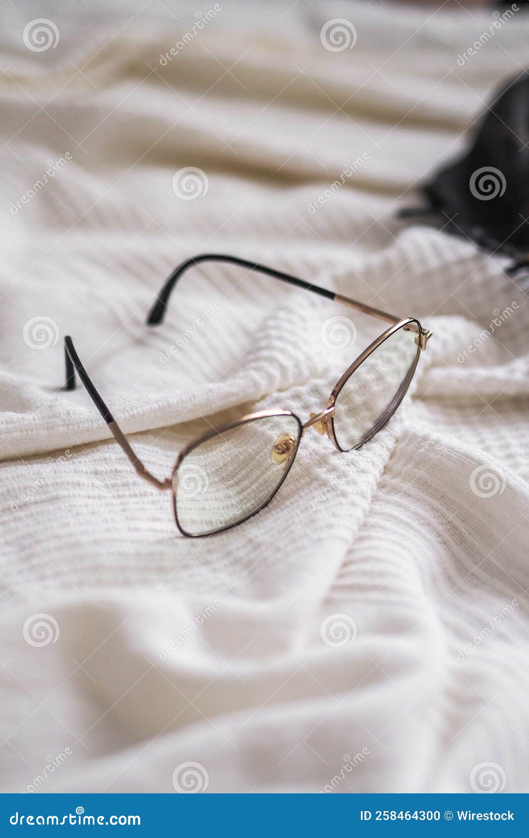 Vertical Top View of Eyeglasses on a White Comforter Stock Photo ...