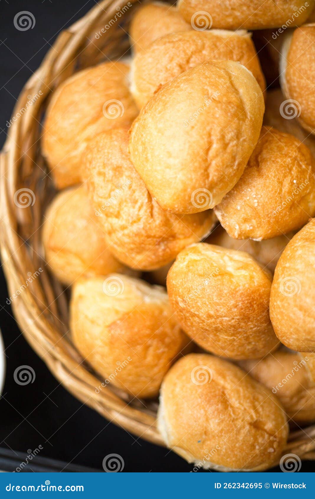 Vertical Top View of Fresh, Small Round Bread in a Thatch Basket Stock ...