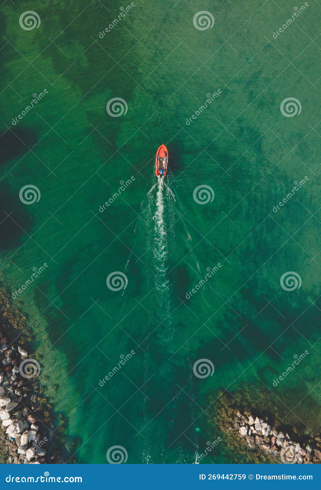 Vertical Top View of a Red Boat Sailing on Green Water Stock Image ...