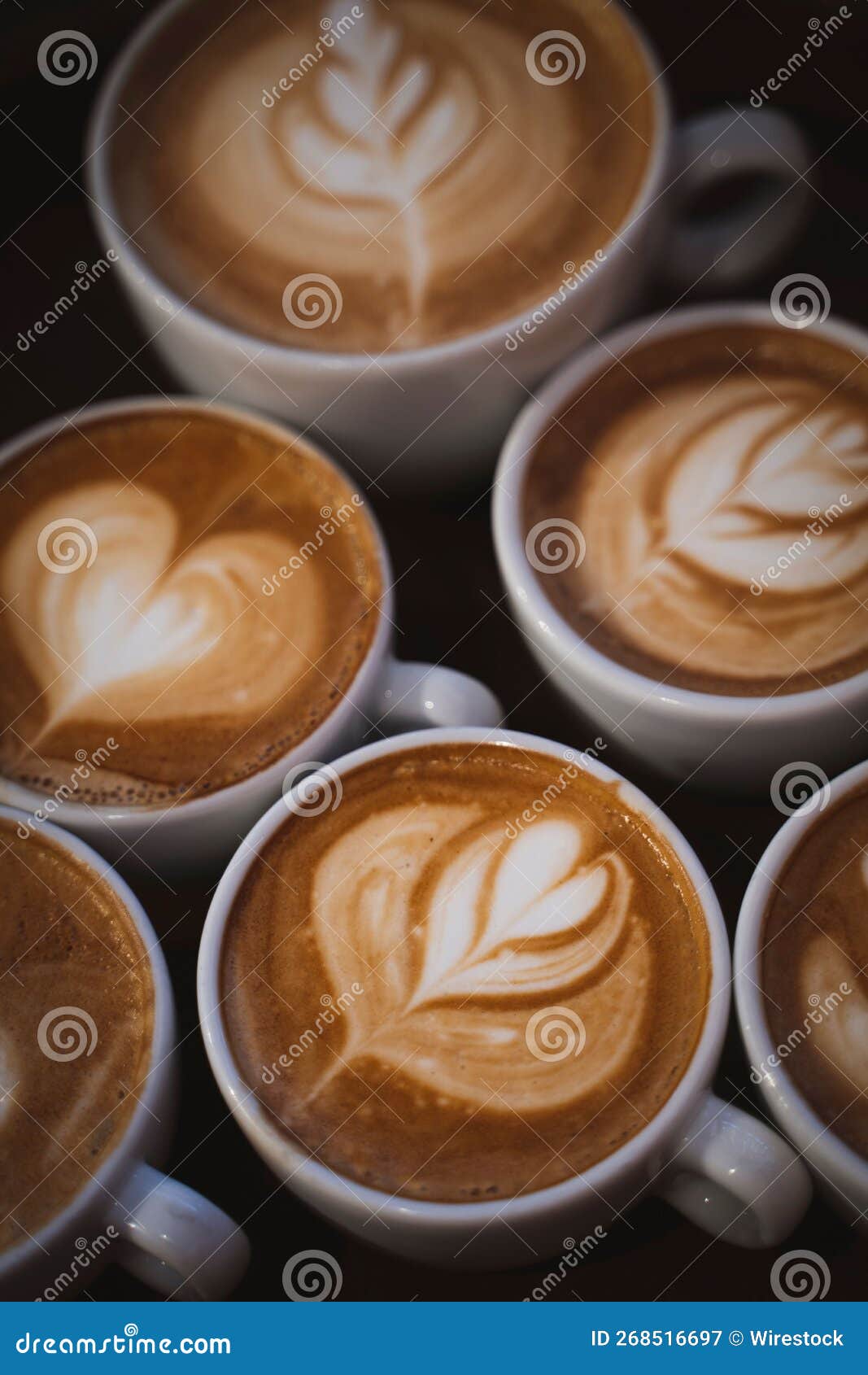 Vertical Top View of Several Cups of Latte with Different Patterns ...