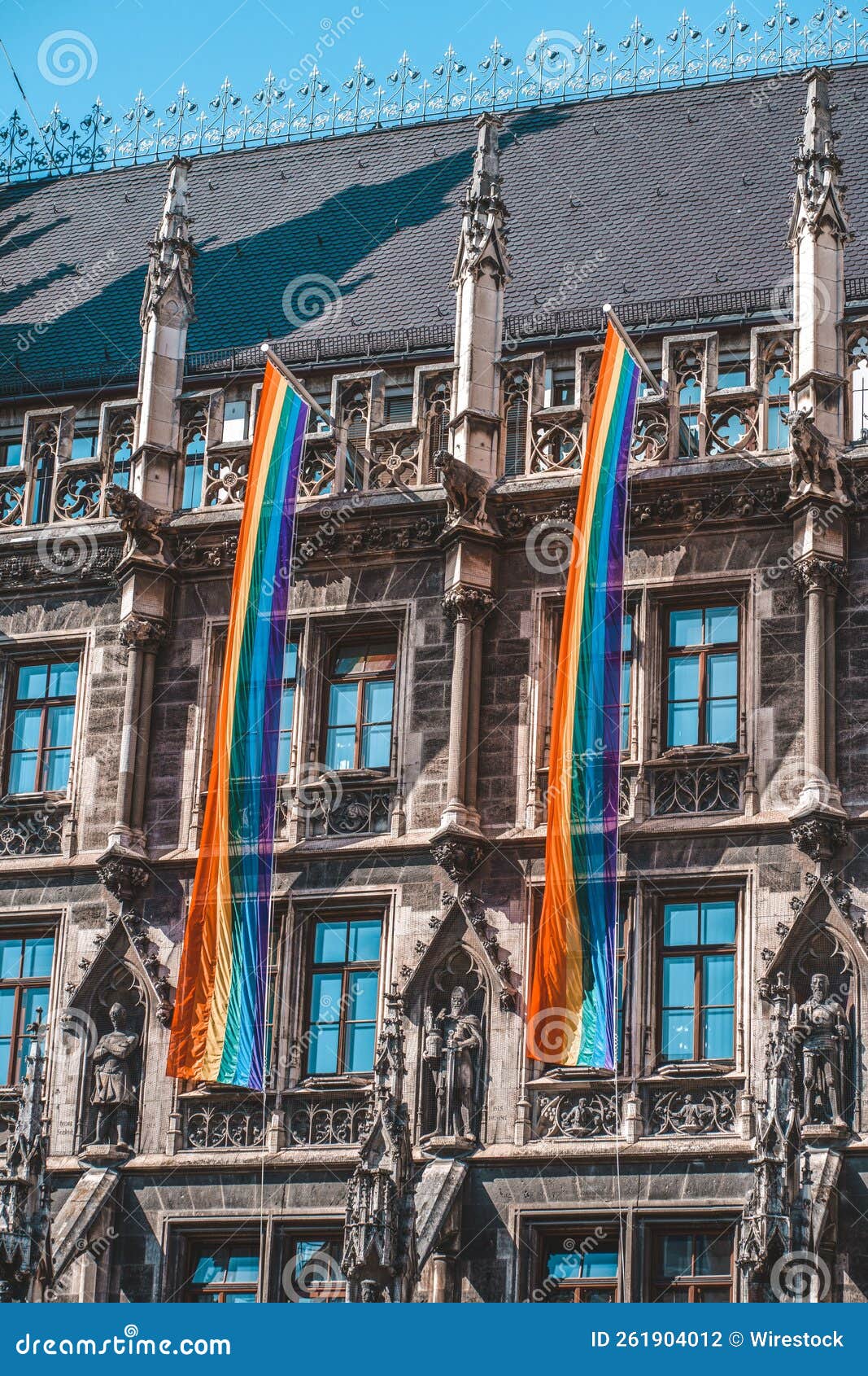 Vertical of Two Long Pride Flags Hanging from an Old Style ...