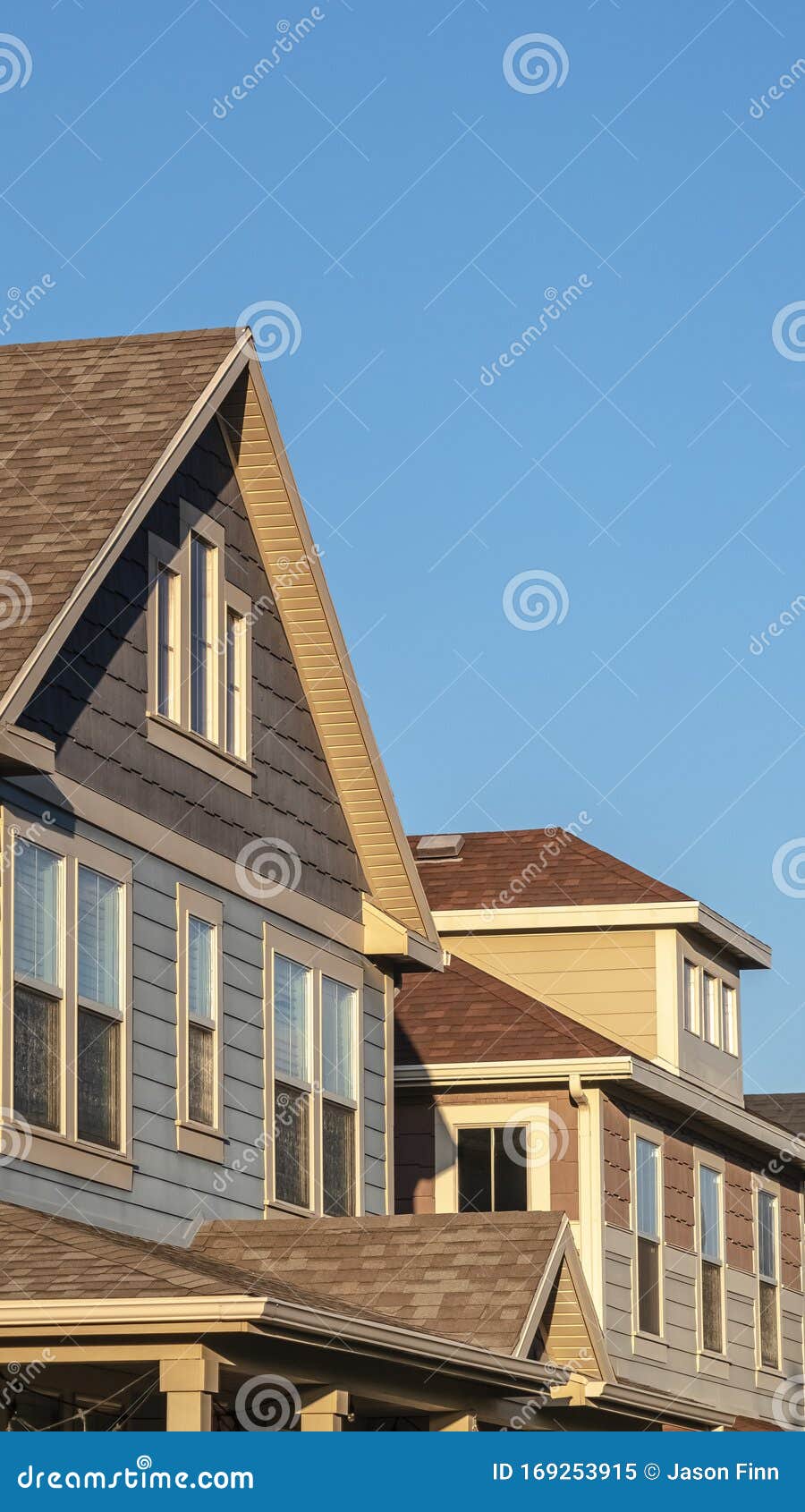 Vertical Upper Facades of a Row of Timber Clad Houses Stock Image ...