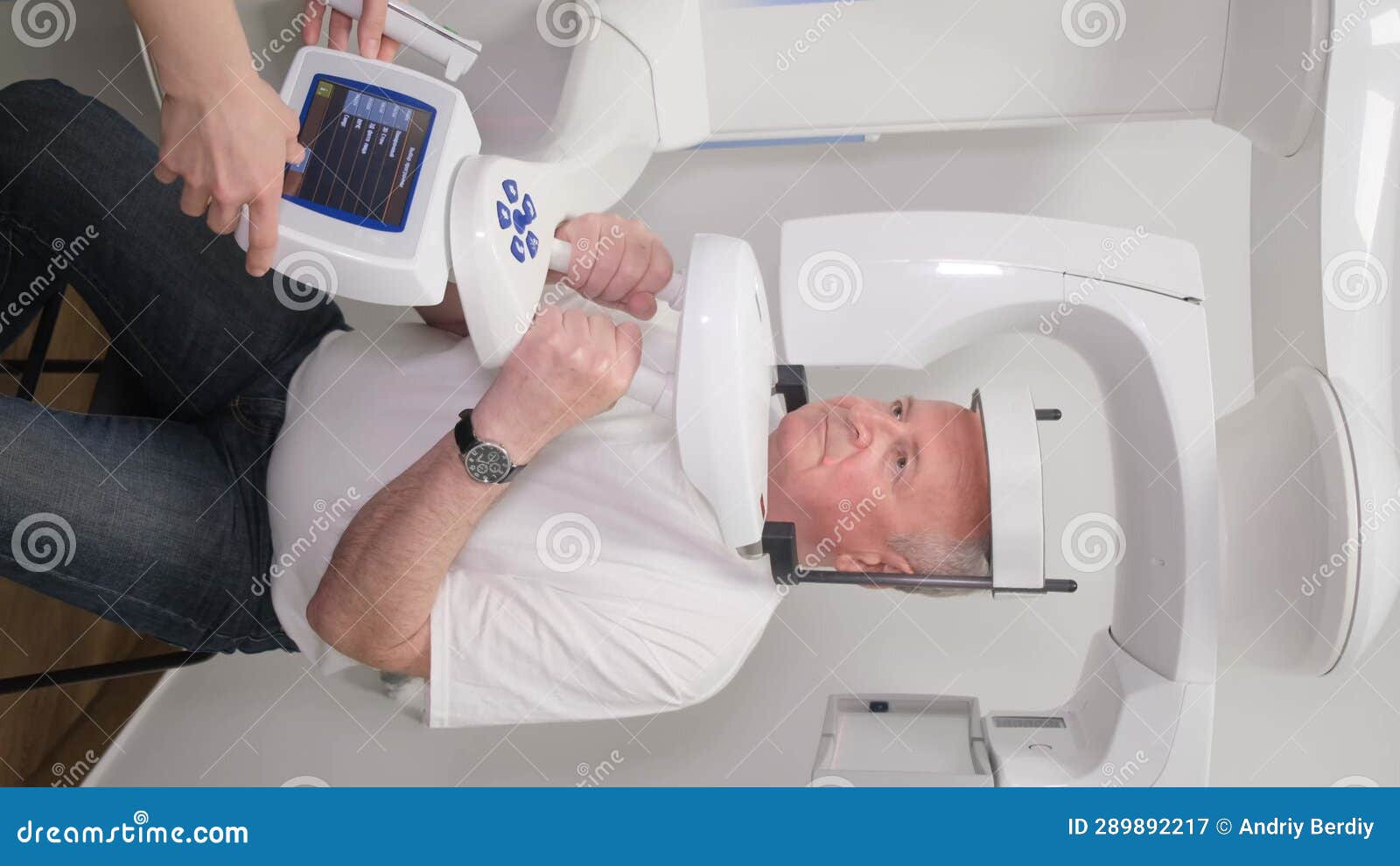 Vertical Video of an Older Man in an X-ray Machine with a Cephalometric ...