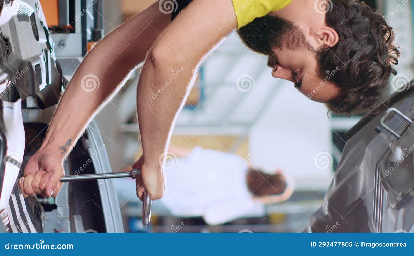 Vertical Video Serviceman in Car Service Uses Wrench Stock Video ... Vertical Video Serviceman in Car Service Uses Wrench Stock Video ...