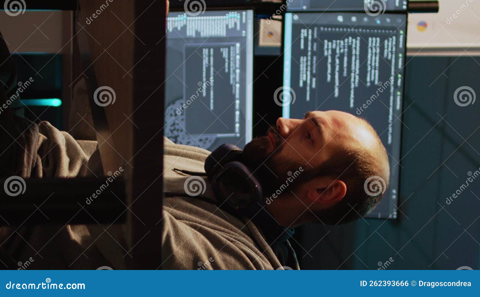 Vertical Video System Programmer Typing Source Code On Laptop And Multiple Monitors Stock