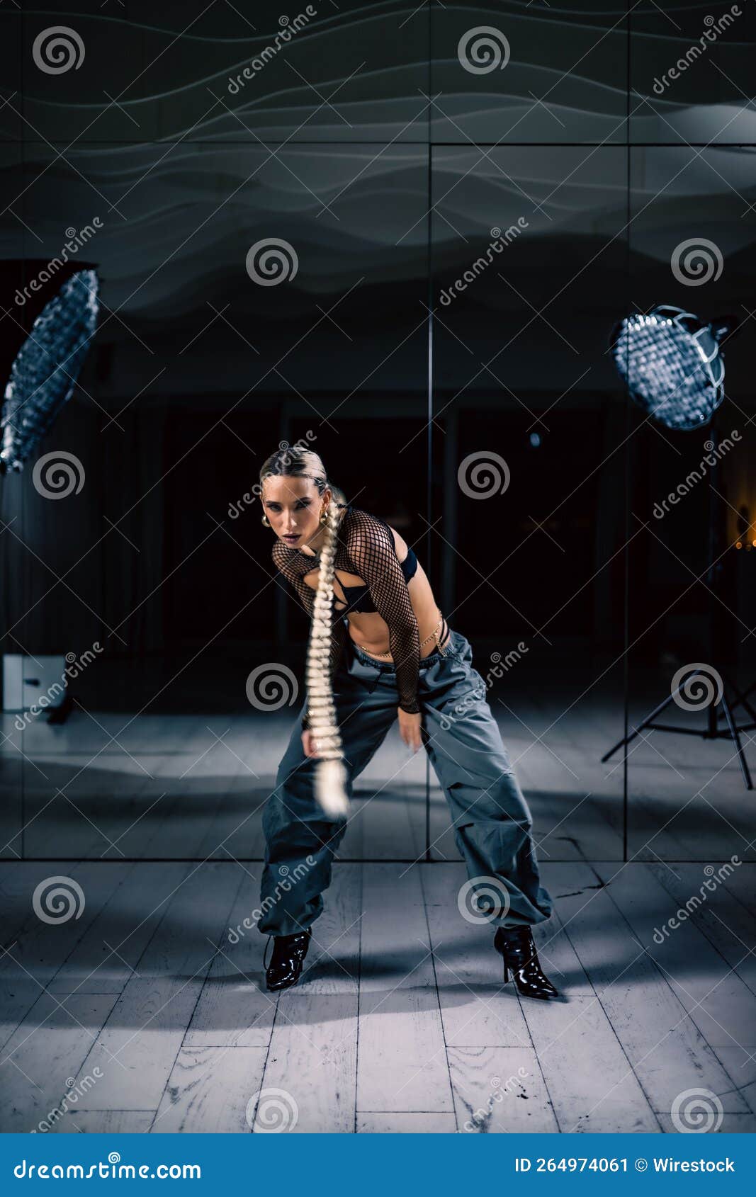 Vertical View of an Attractive Stiletto Dancer Posing before the Mirror ...