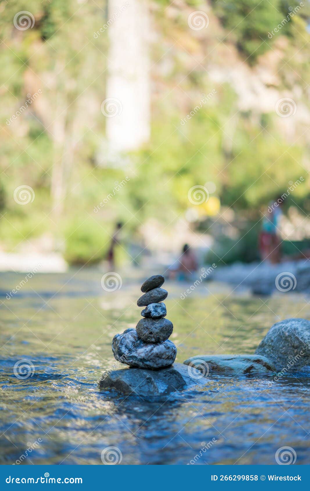 Vertical View of Balanced Stacked Pebbles in a River Stock Photo ...