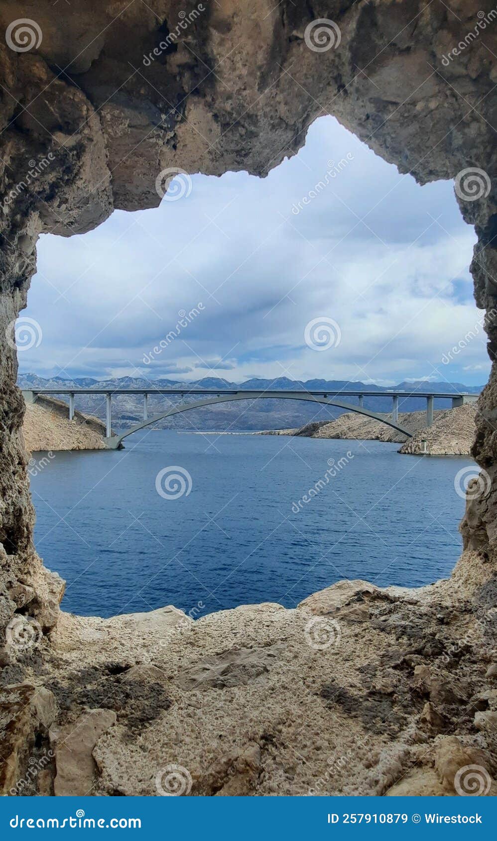 Vertical of a View of the Bridge from a Rock Cave. Stock Image - Image ...
