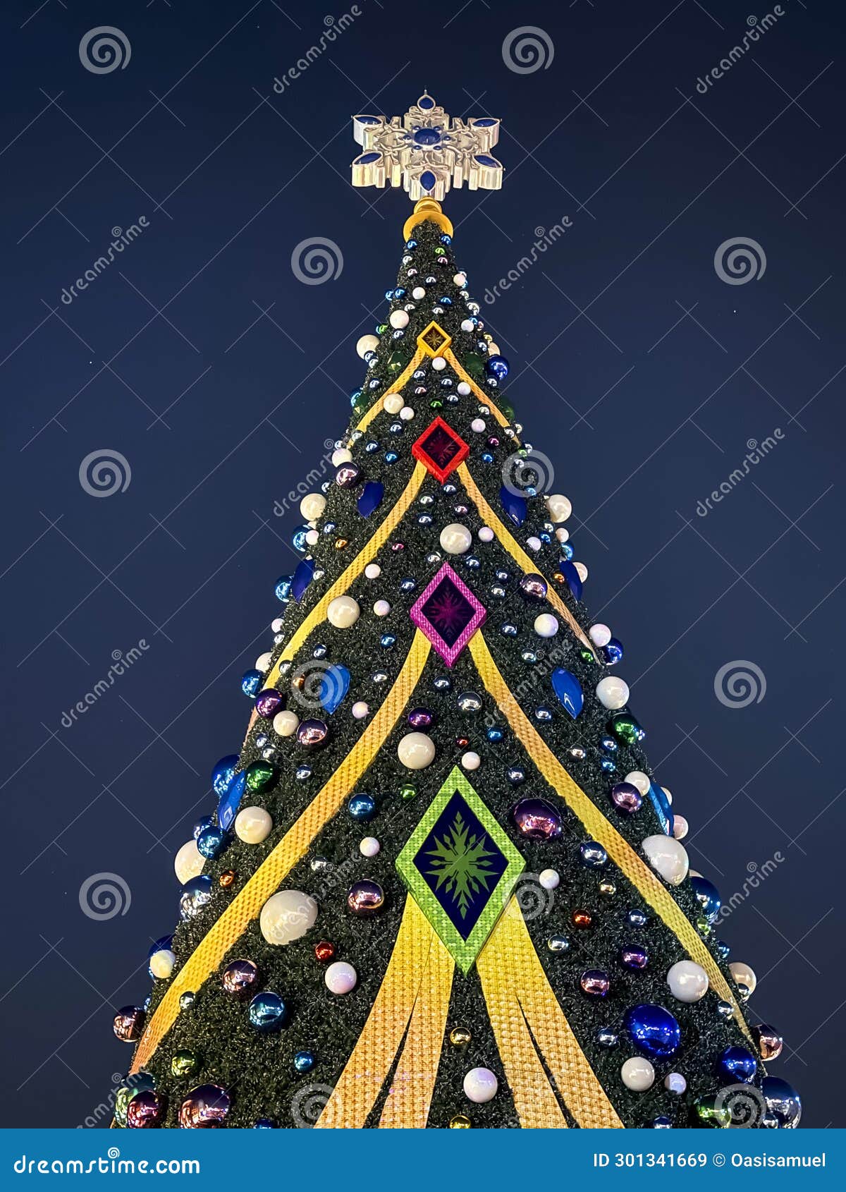 A Vertical View of a Christmas Tree that Lit Up in Various Colours ...