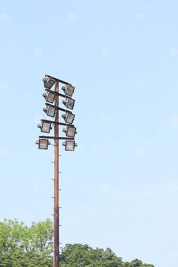 Vertical View of a Column with Projector Lights before the Blue Sky ...