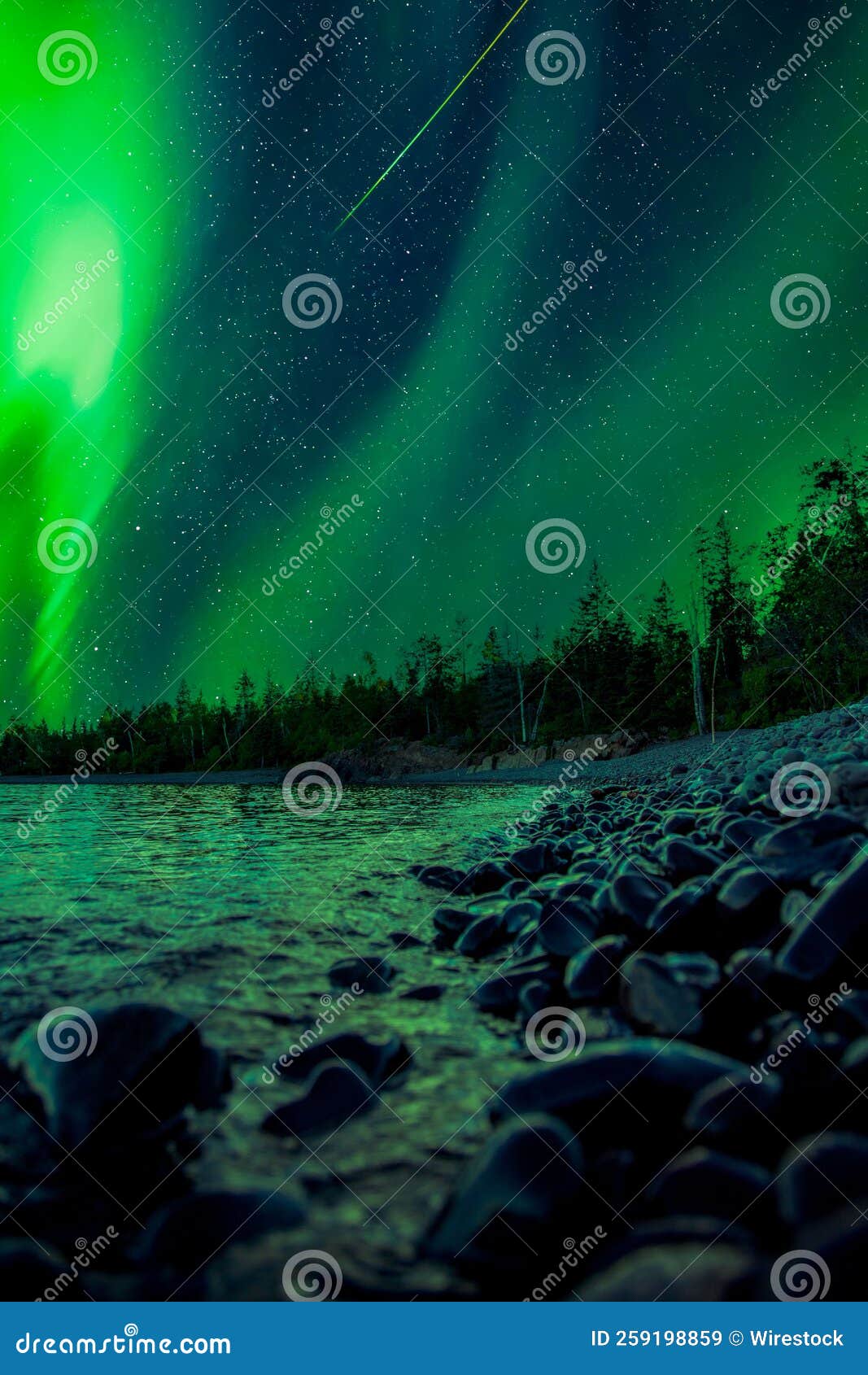 Vertical View of a Falling Star at the Beach with Green Auroras in the ...