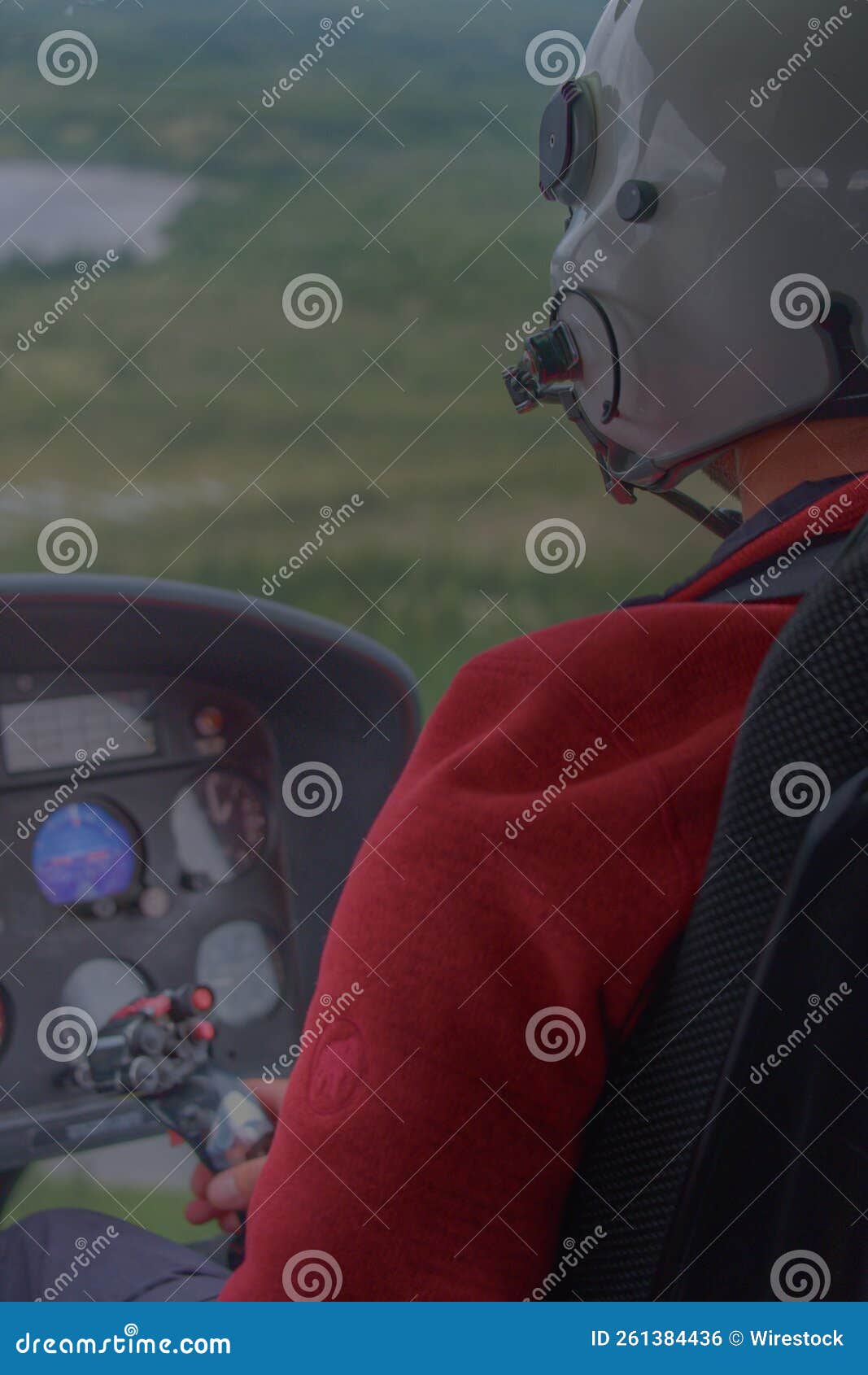 Vertical View of the Interior of a Caucasian Pilot in a Helicopter that ...