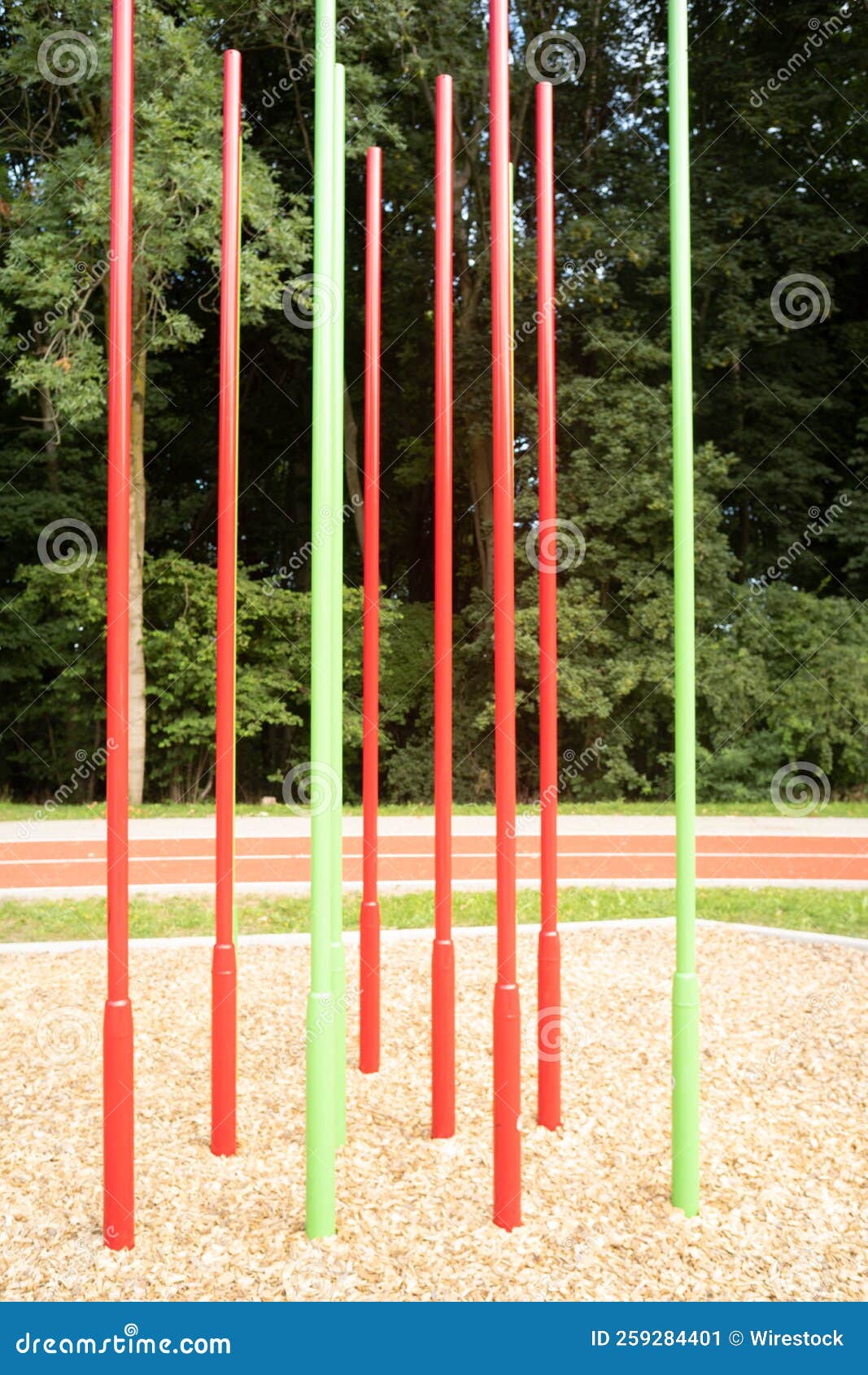 Vertical View of Red and Green Columns in a Park Stock Image - Image of ...