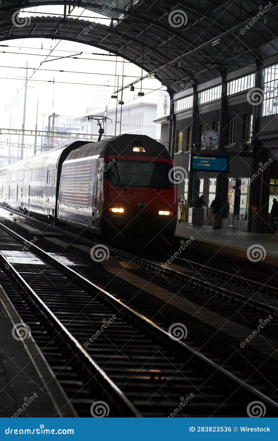 Vertical View of a Red Train Entering a Train Station in Olten ...