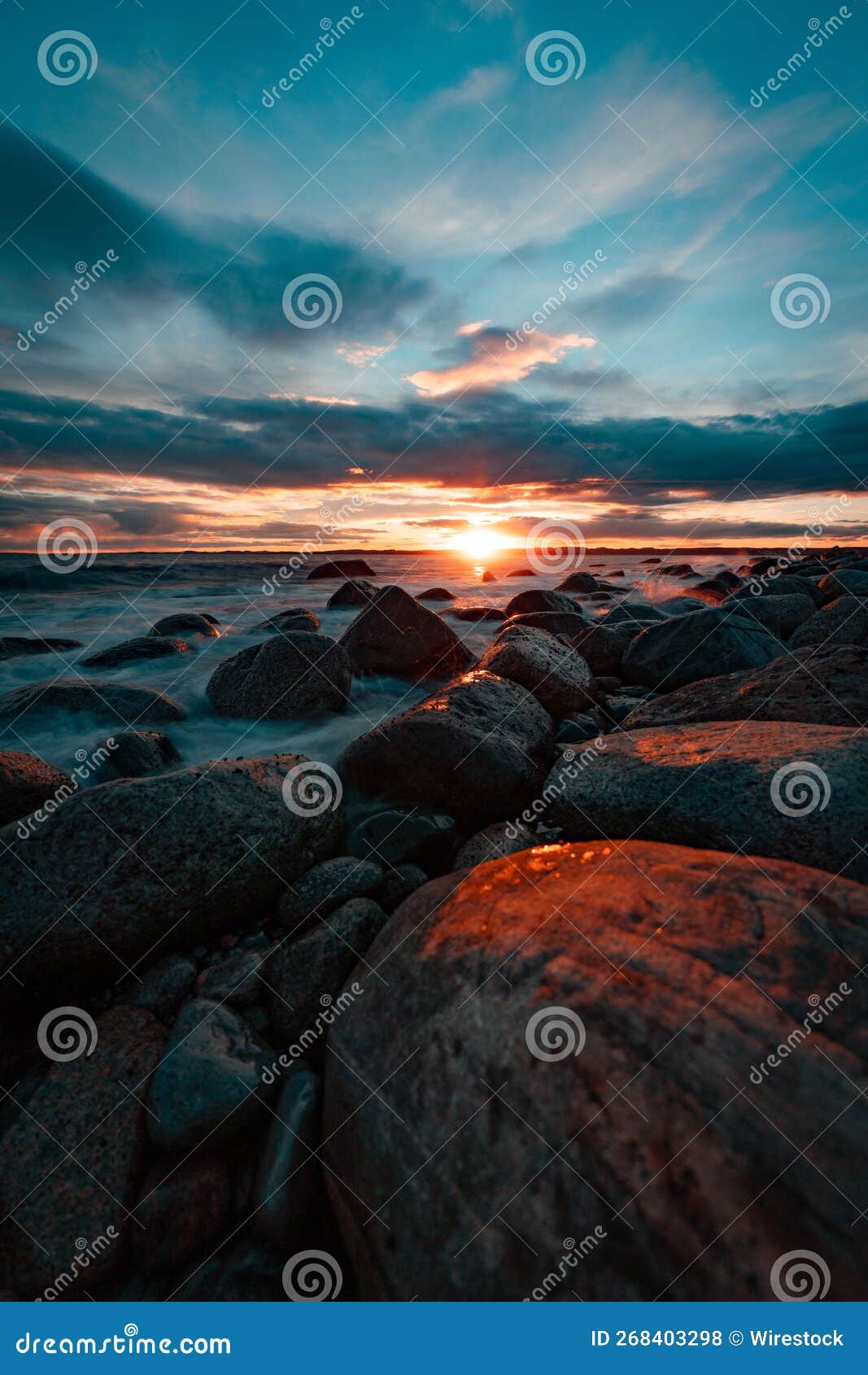 Vertical View of a Rocky Coast of an Ocean at Sunset Stock Photo ...