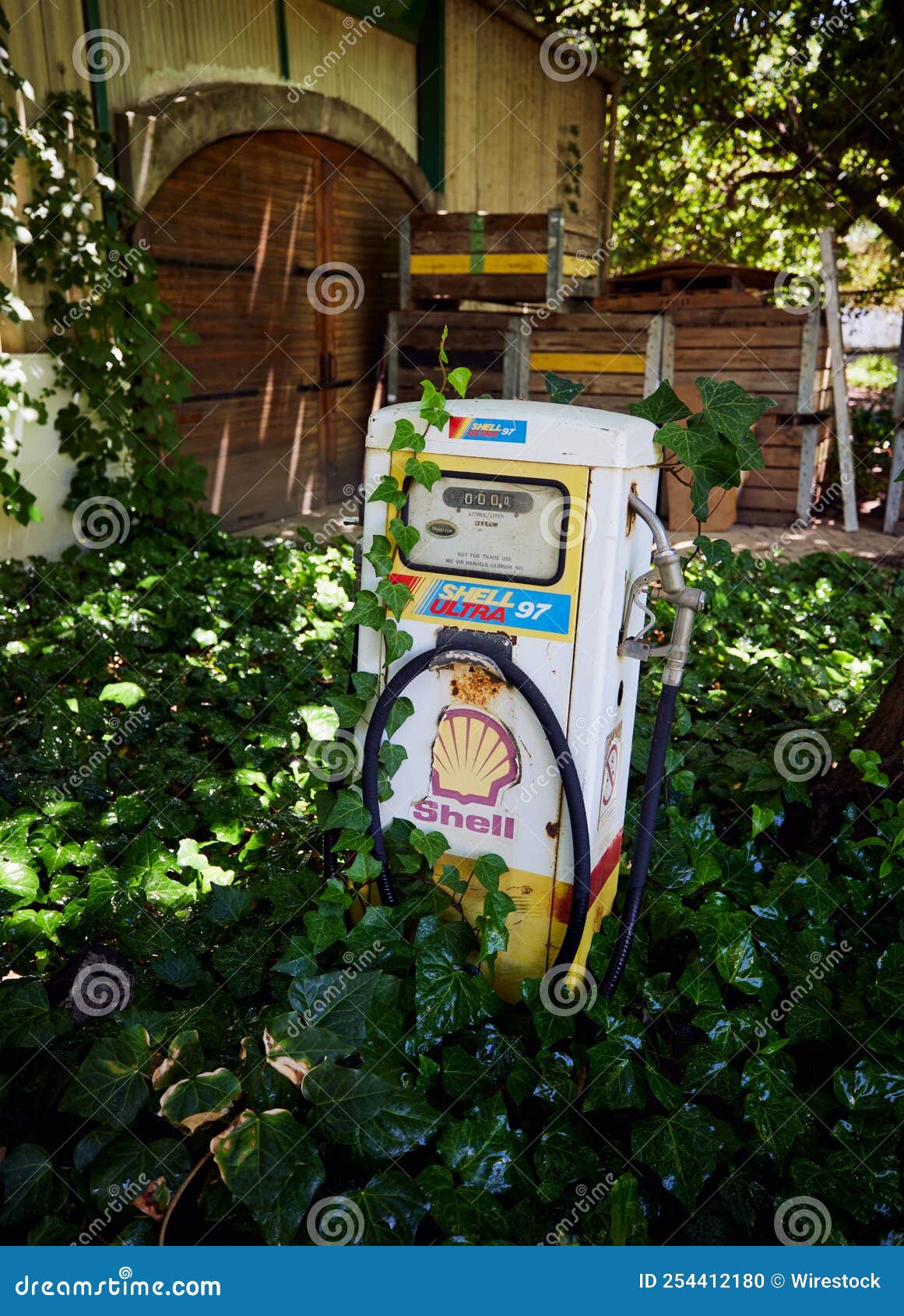 Vertical View of a Shell Fuel Dispenser in the Green Leaves Editorial ...