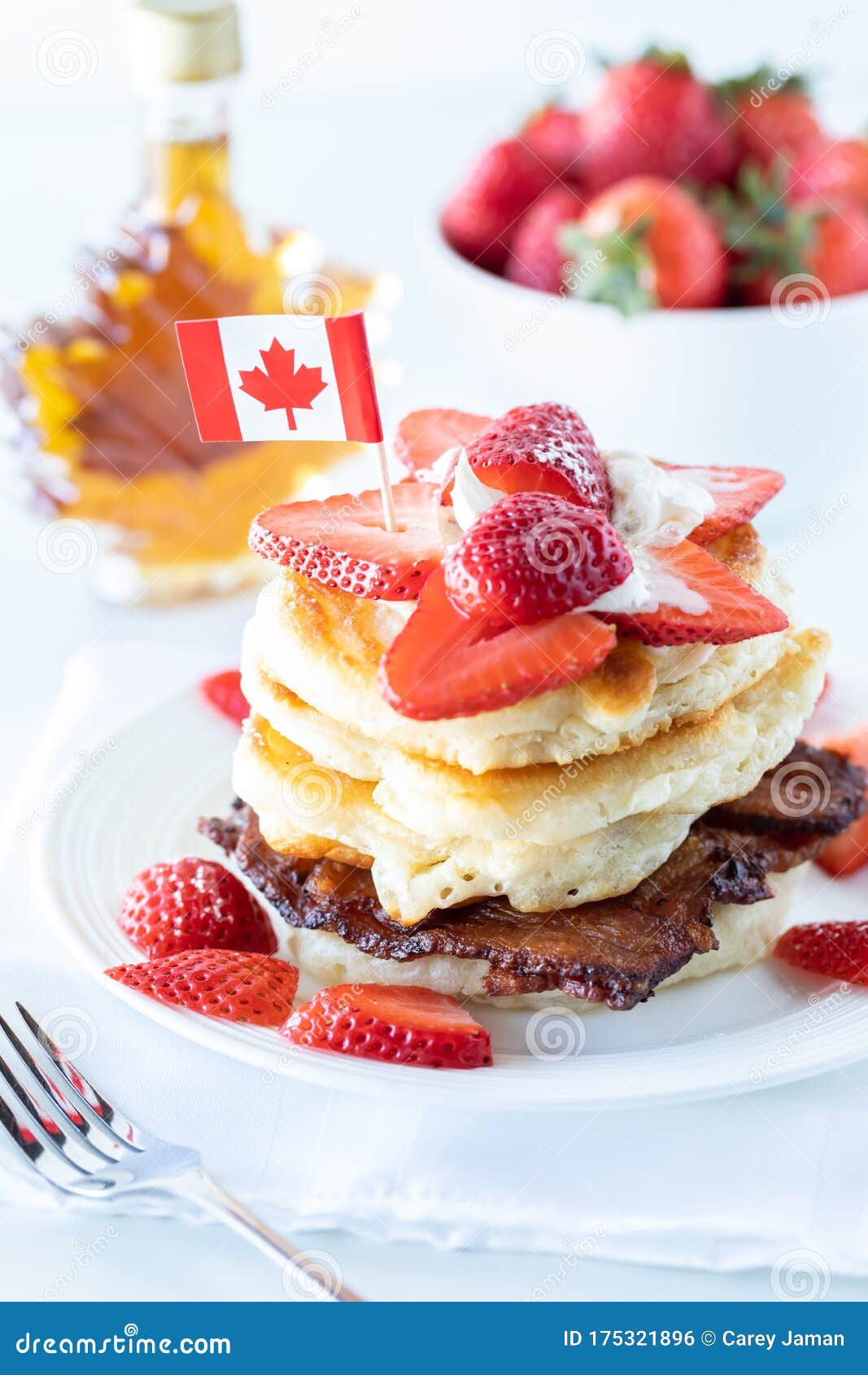 A Vertical View of a Stack of Pancakes with Strawberries and Syrup To ...