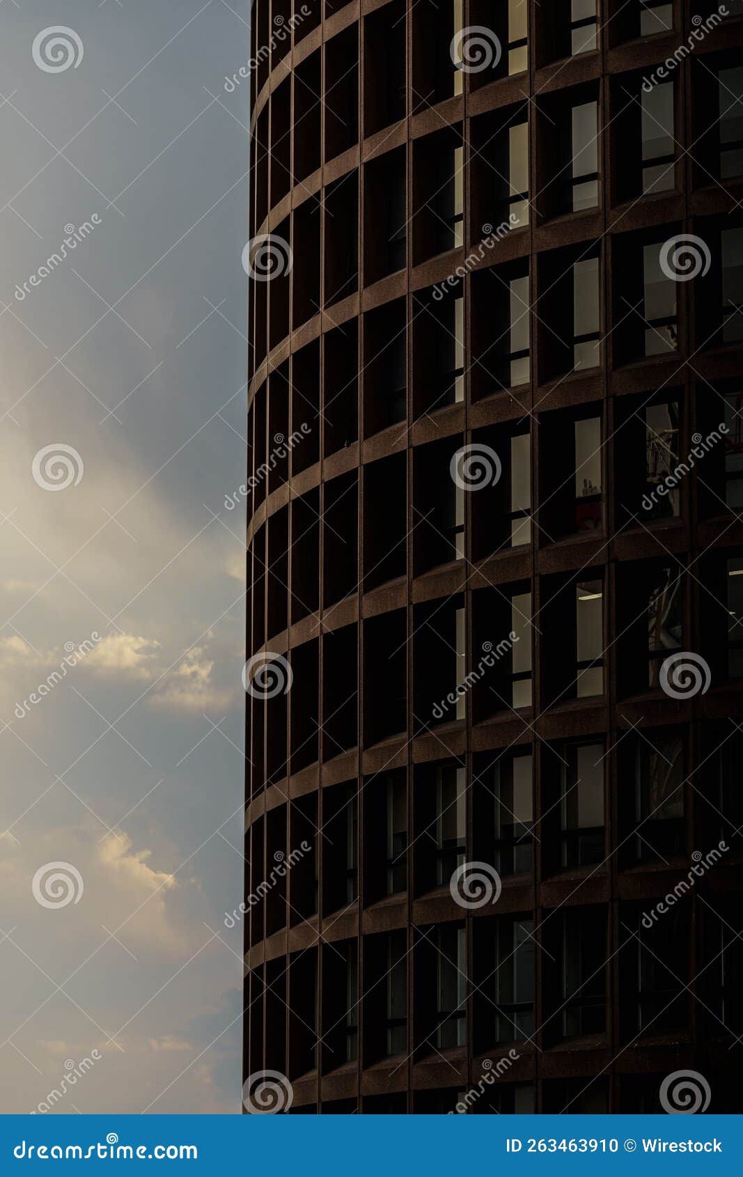Vertical View of a Tall Building with Cylindrical Shape and Many ...