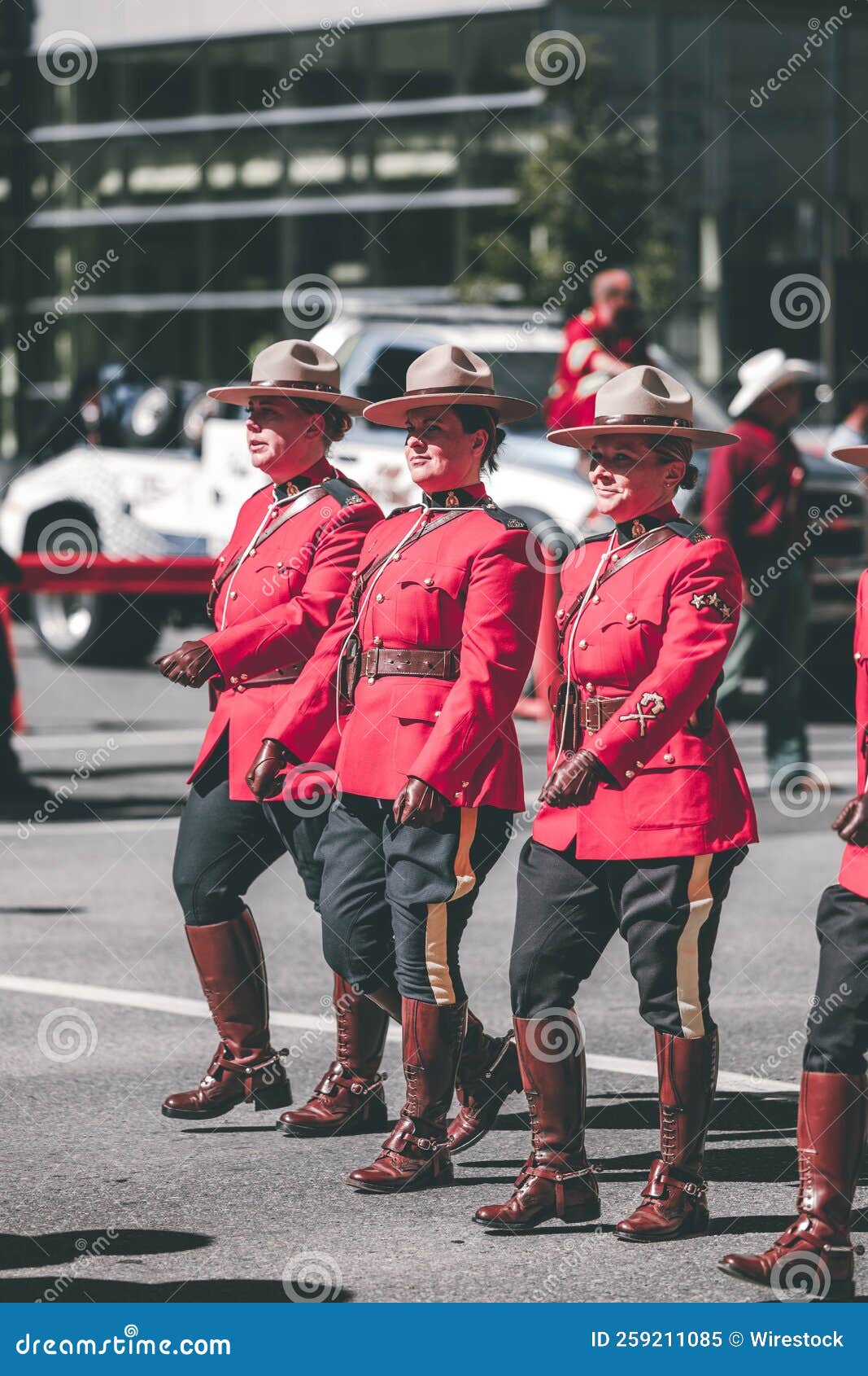 Vertical View Of Three Female Rcmp Officers At The Calgary Stampede Parade Editorial Image 0411