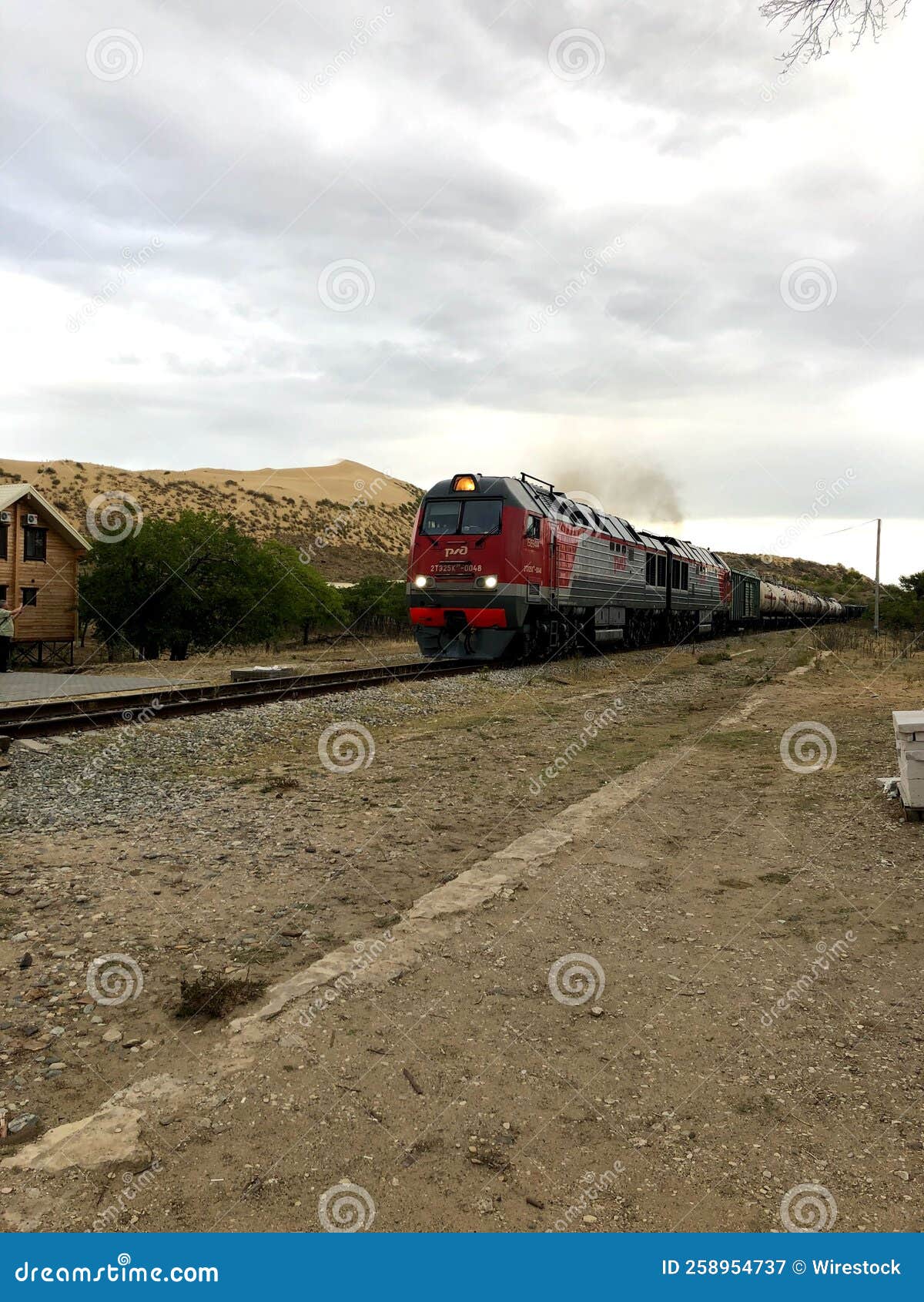 Vertical View of a Train Driving through the Dagestan Desert Under the ...