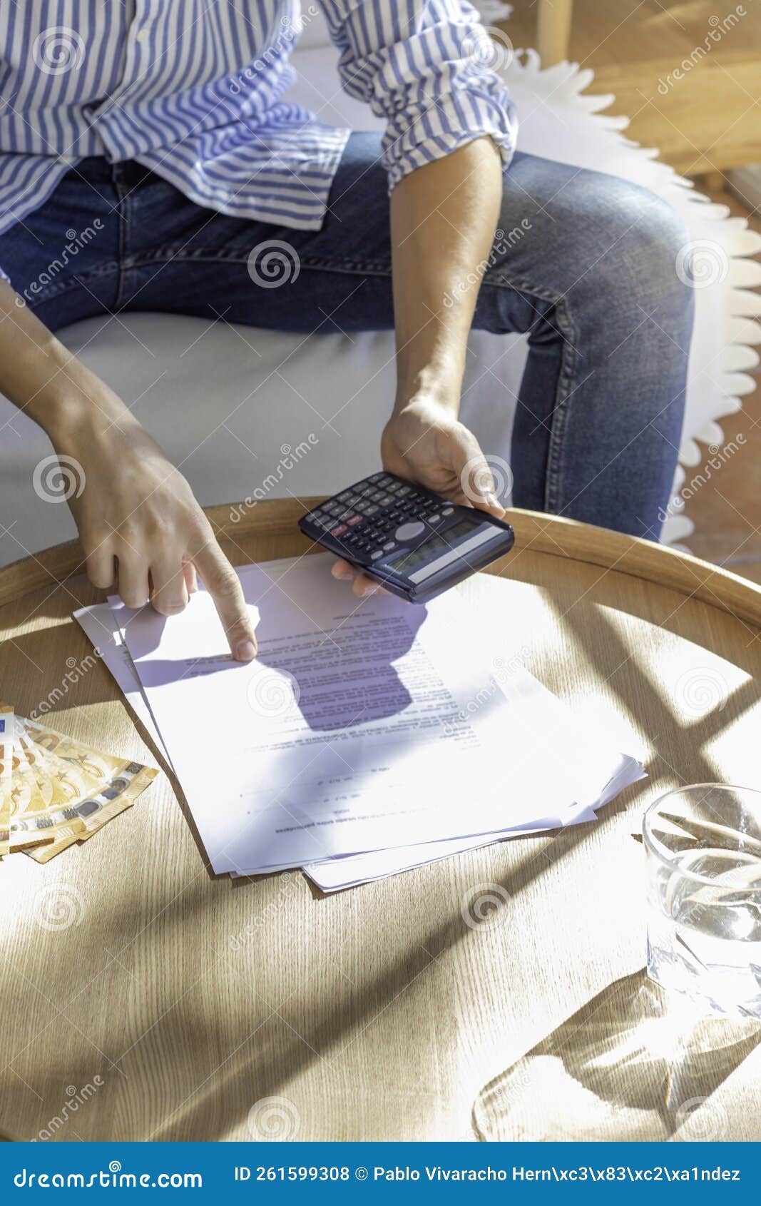 Vertical View of Young Man Making Calculations about the Contract and ...