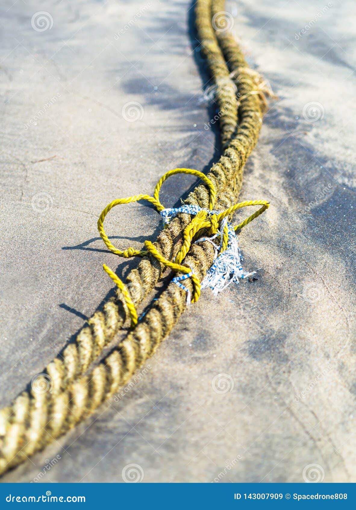Vertical Vivid Yellow Rope on the Sand Beach Background Backdrop Stock ...